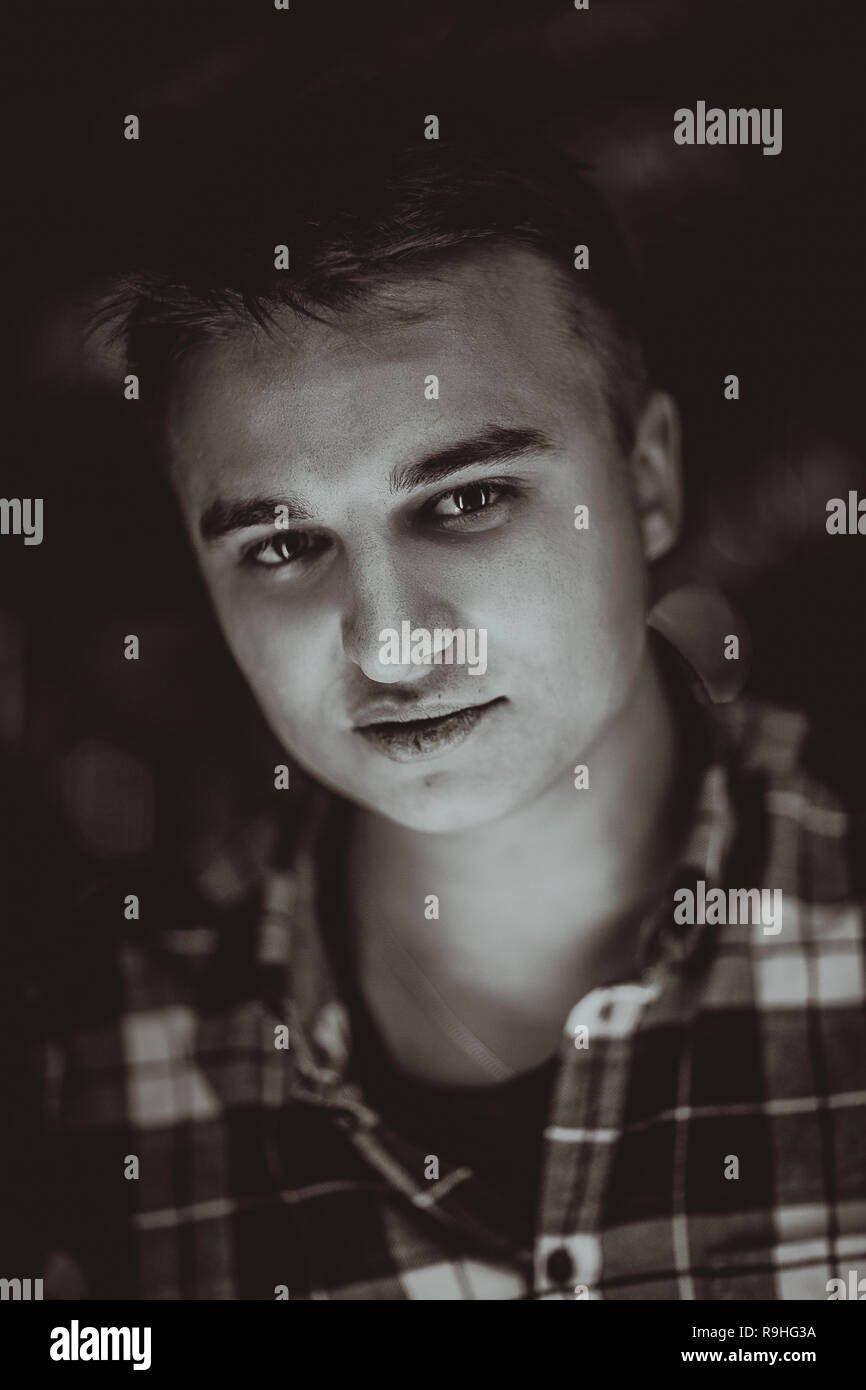 black white photo portrait of a young man on a blurred background Stock ...