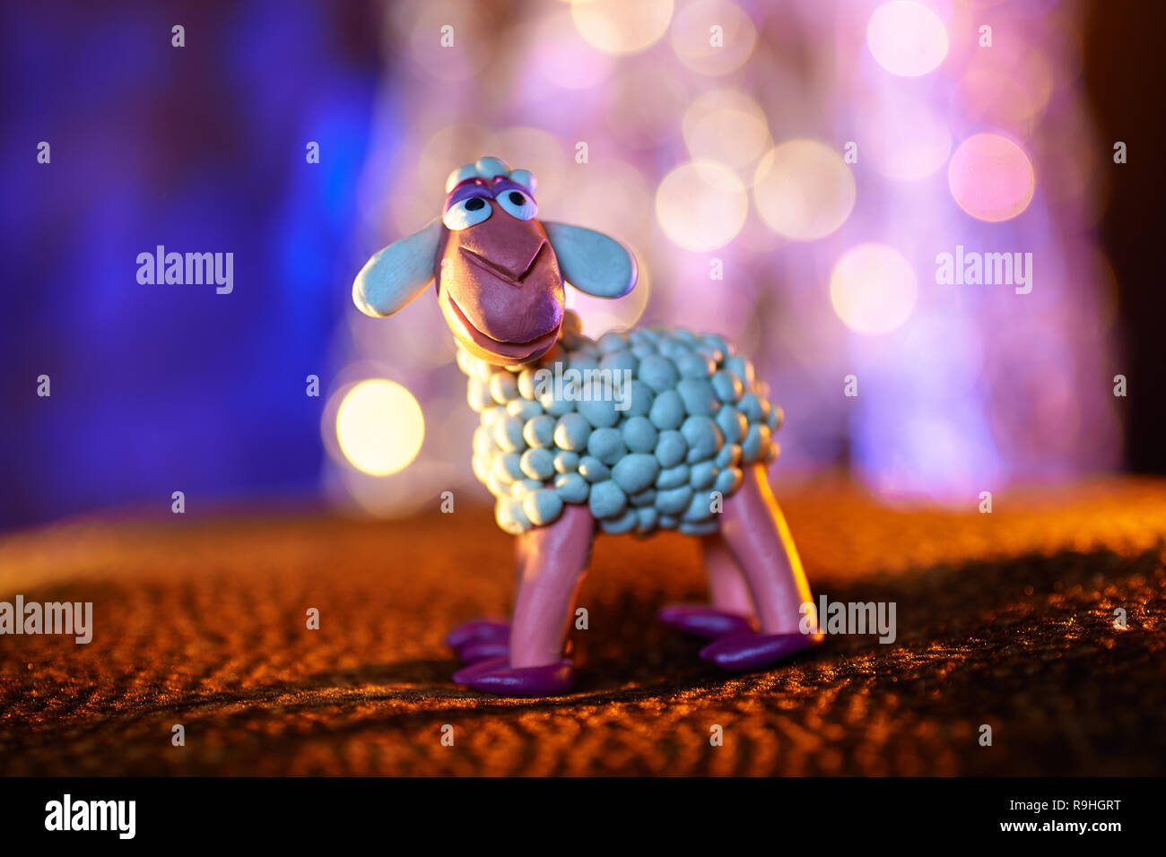 merry plasticine sheep from the Christmas series on a blurred ...