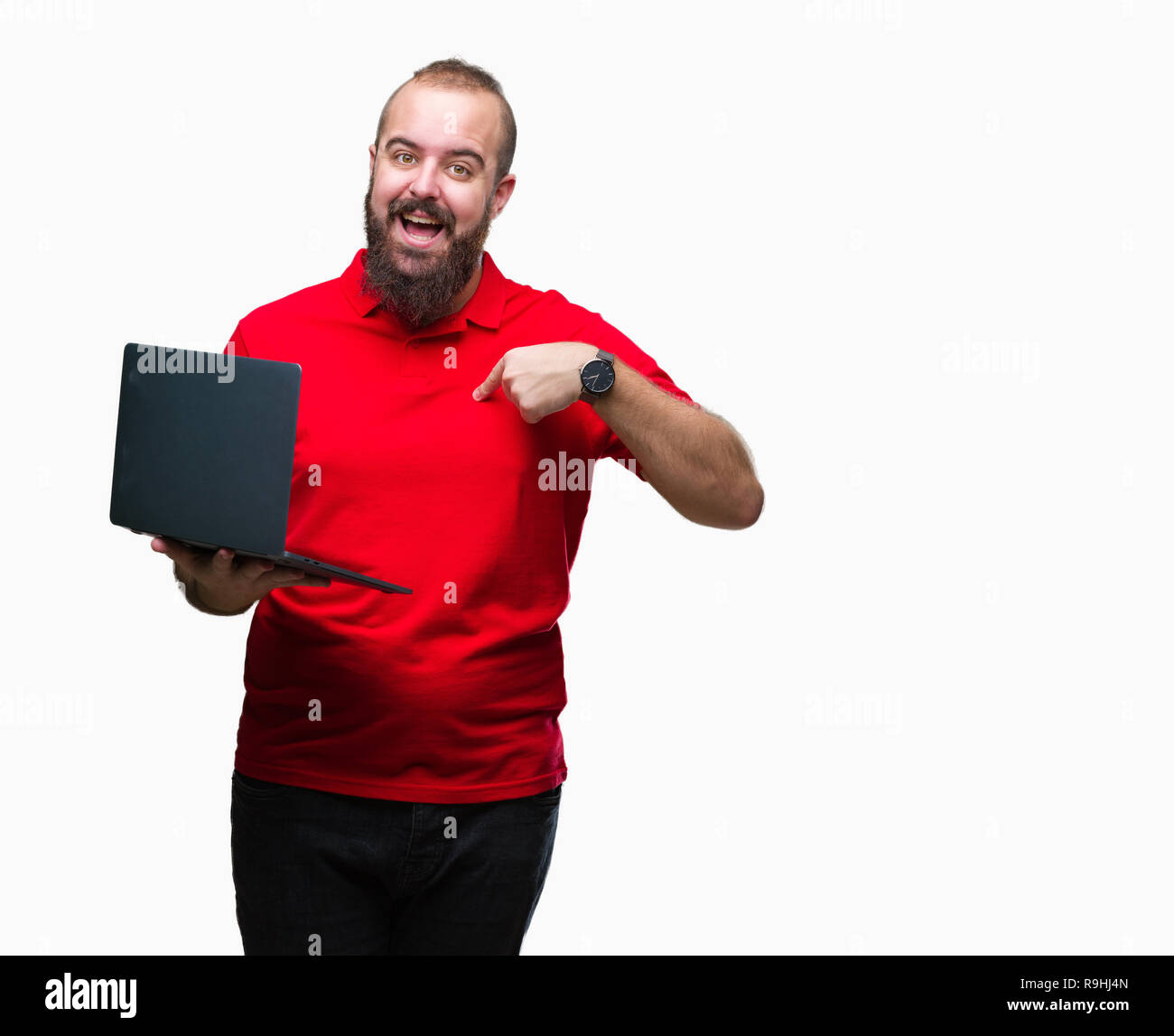 Young caucasian man using computer laptop over isolated background with ...