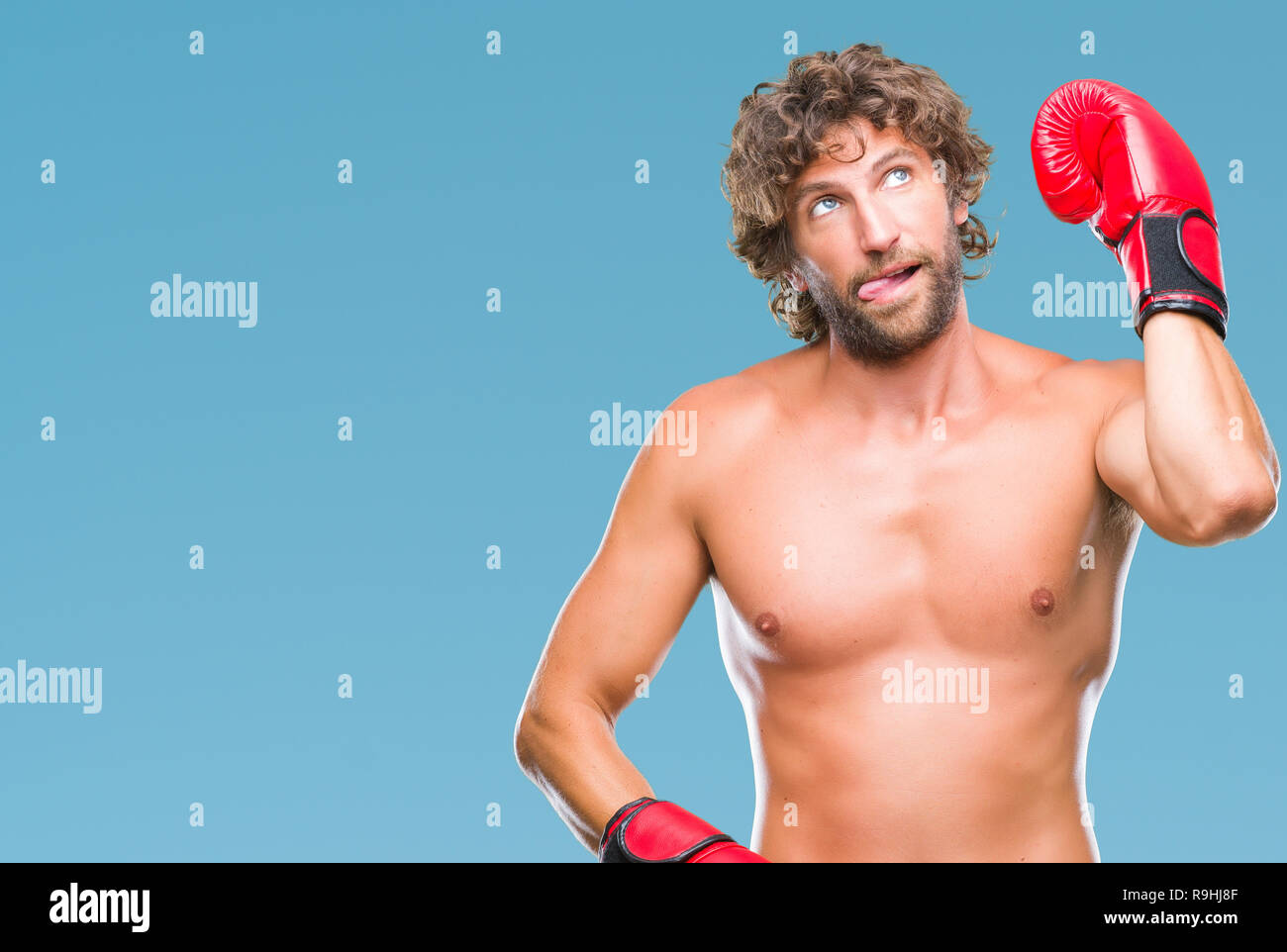 Handsome hispanic boxer man wearing boxing gloves over isolated ...