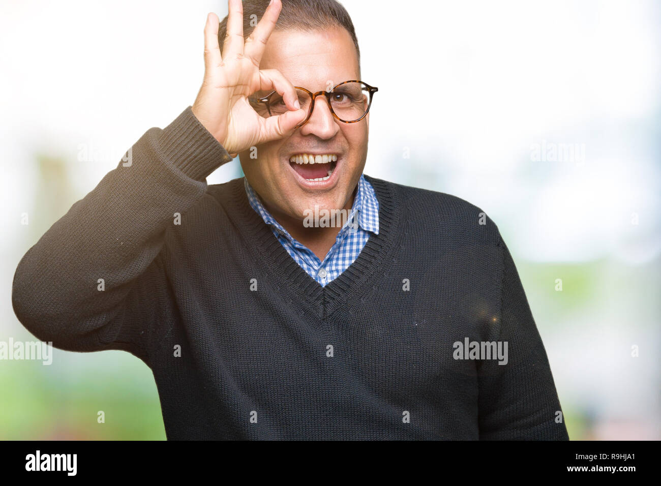 Middle age bussines arab man wearing glasses over isolated background ...