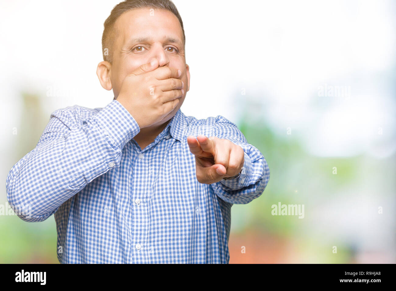 Indian man hand over mouth hi-res stock photography and images - Alamy