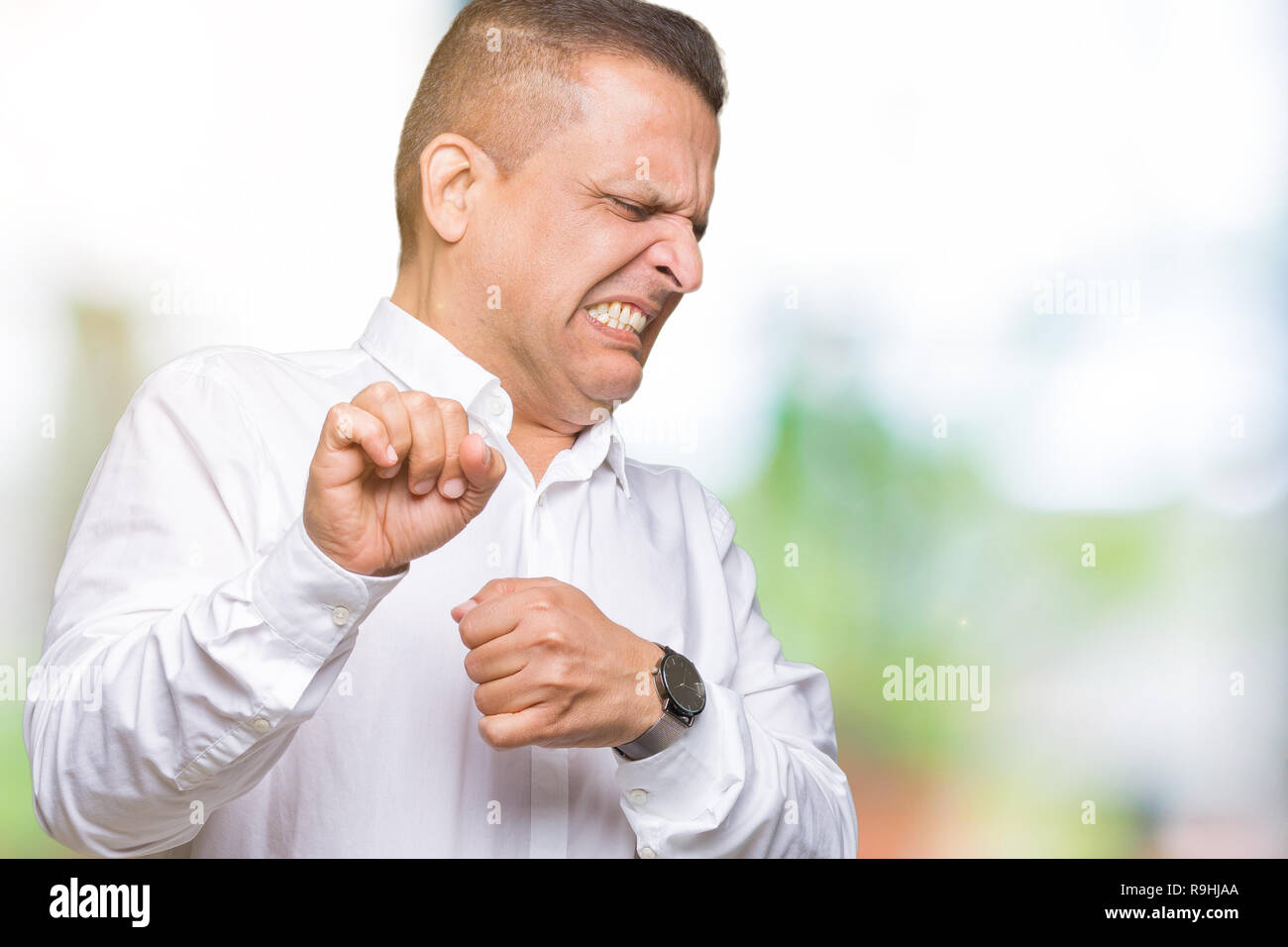 Middle age arab elegant man over isolated background disgusted ...