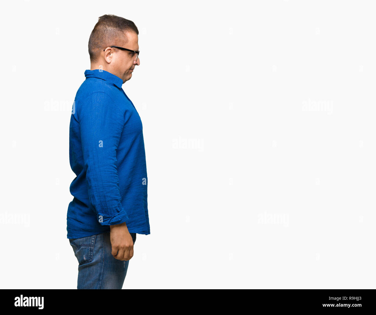 Middle age arab man wearing glasses over isolated background looking to ...