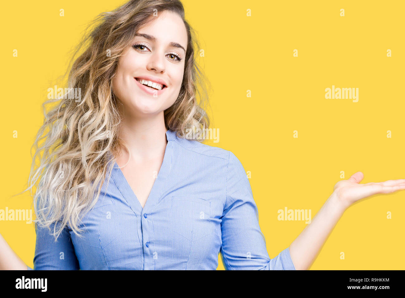 Beautiful young blonde business woman over isolated background Smiling ... Beautiful young blonde business woman over isolated background Smiling ...