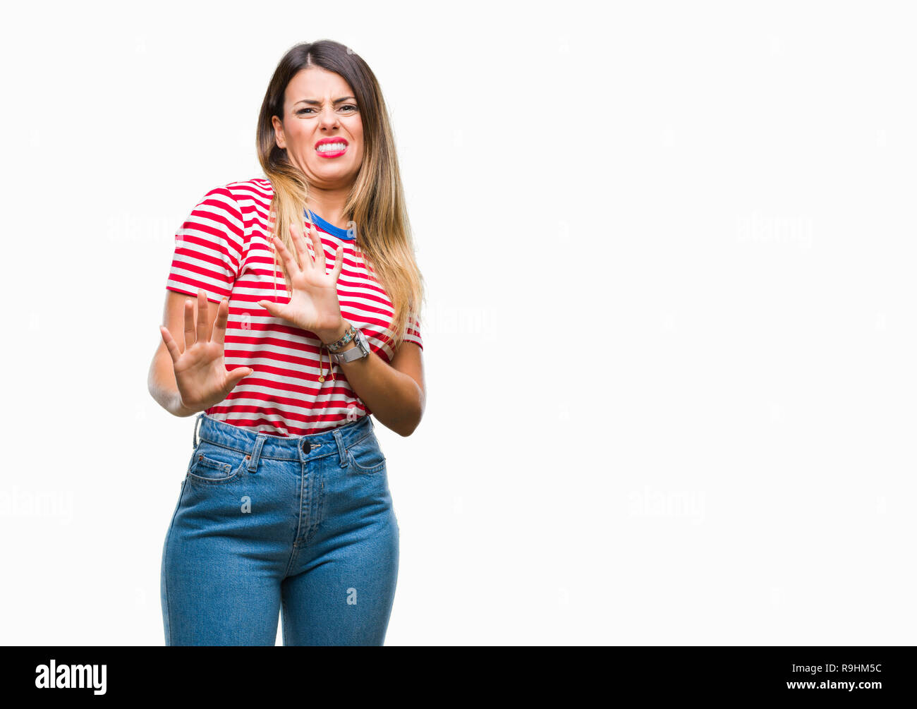 Young beautiful woman casual look over isolated background disgusted ...