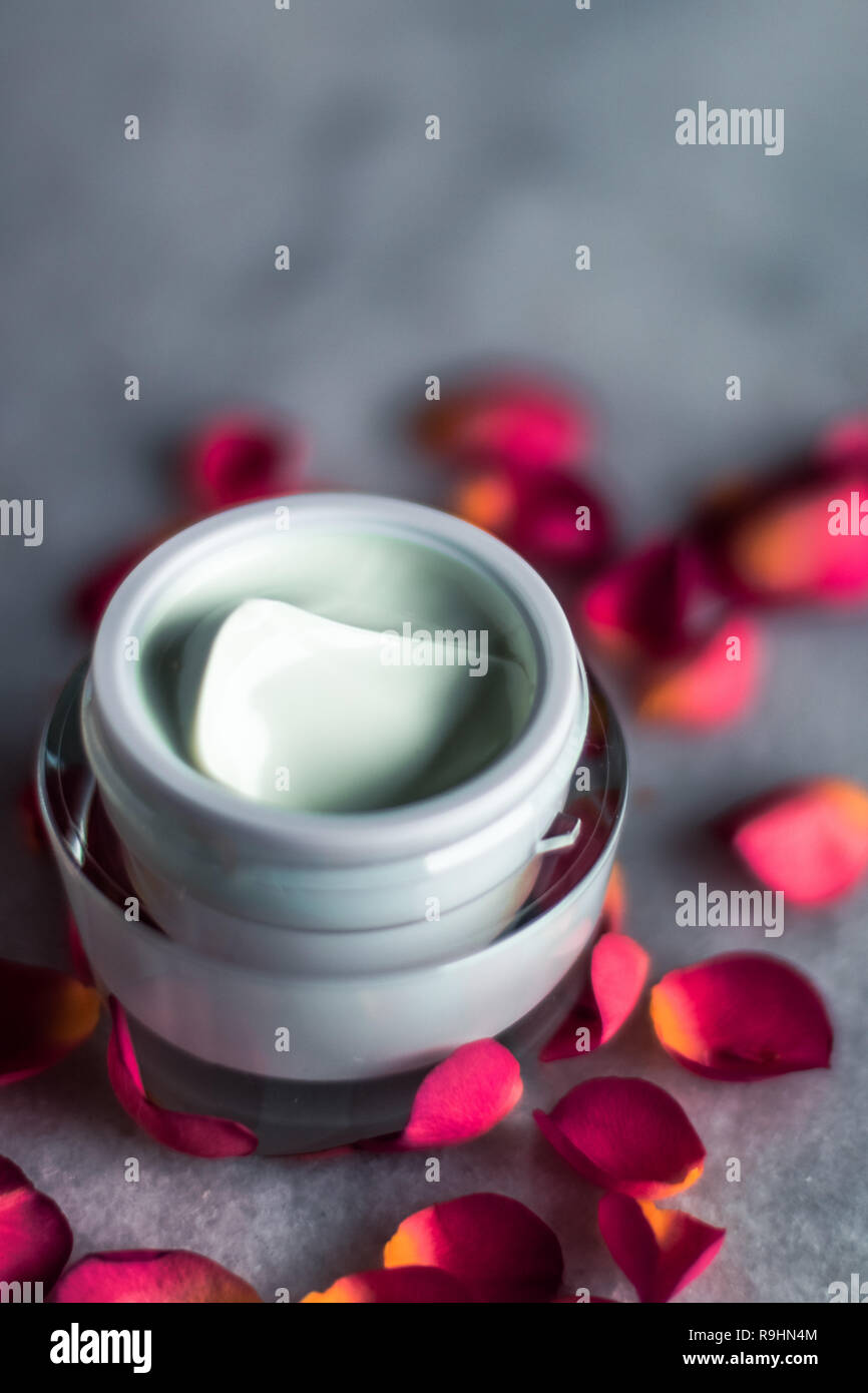 luxe face cream and rose petals - cosmetics with flowers styled beauty ...