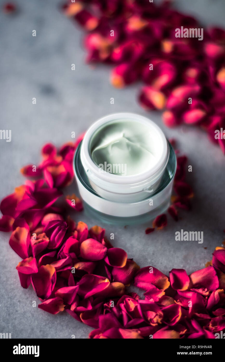 luxe face cream and rose petals - cosmetics with flowers styled beauty ...
