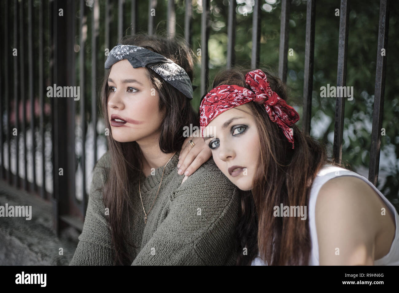 Portrait of two girls outdoors. The concept of difficult teenagers, bad ...