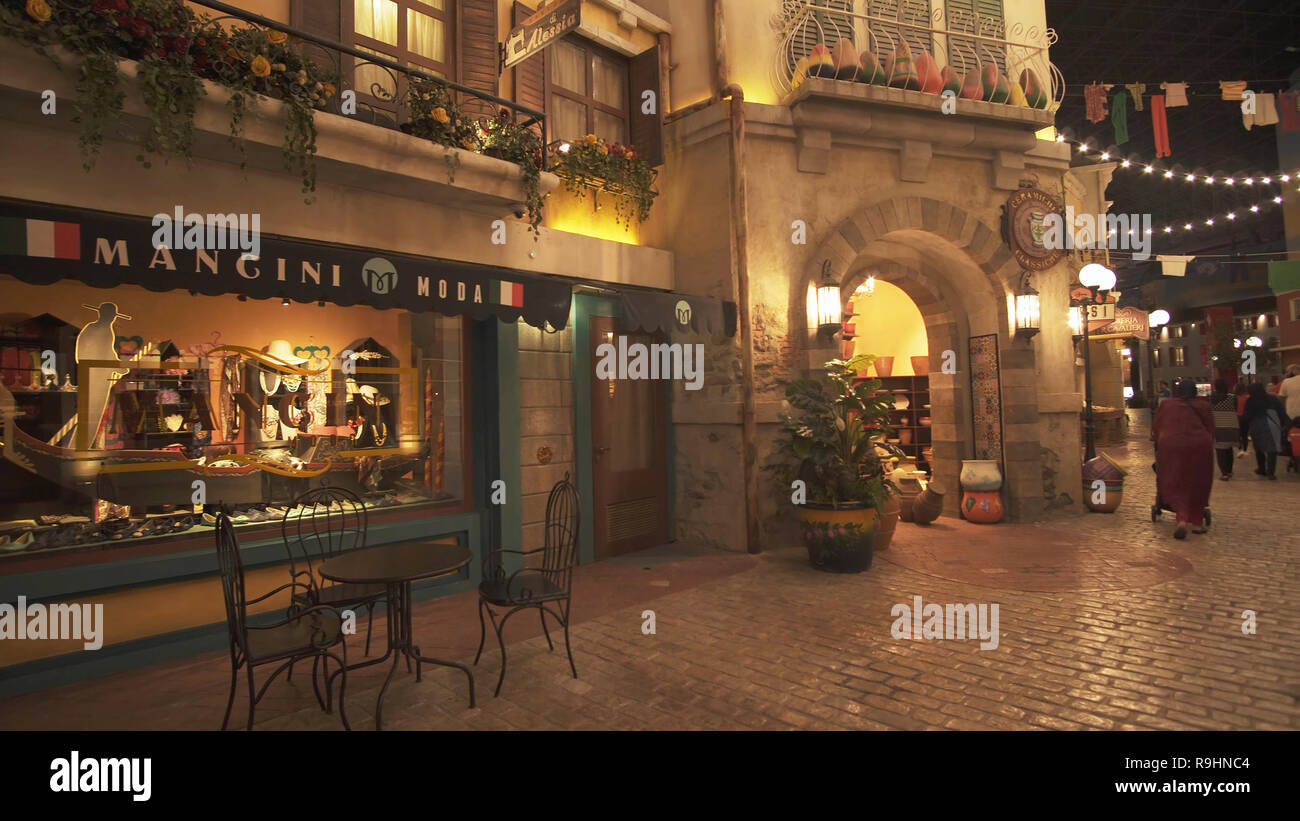 Italian street of cafes and shops in the theme park Ferrari World Abu ...