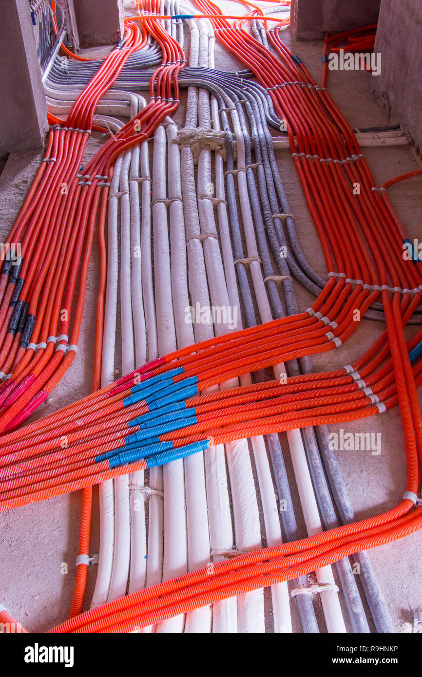 different color tubes on the ground Stock Photo - Alamy