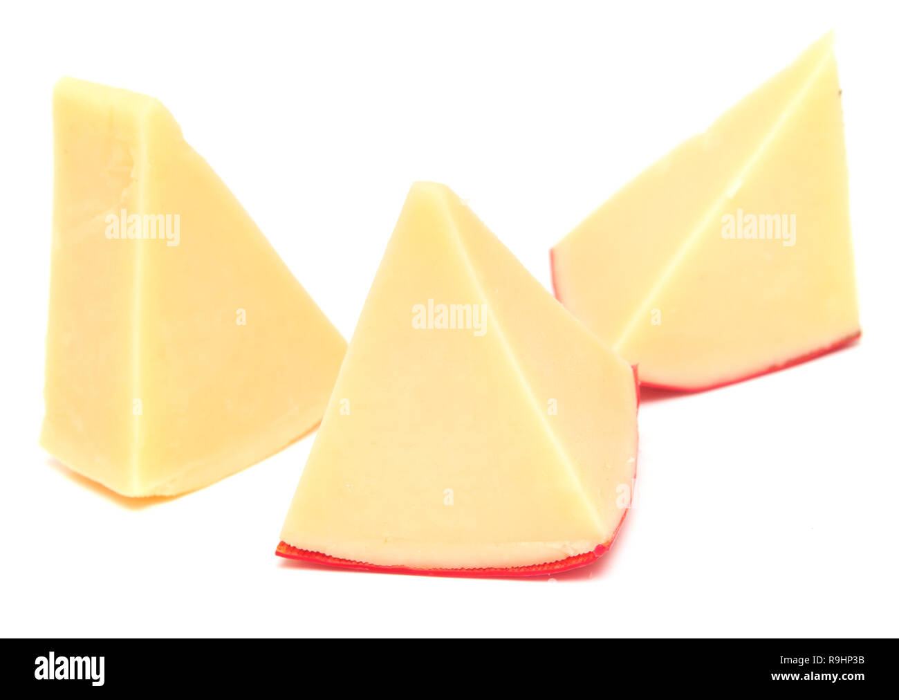 Three pieces of cheese isolated on white background Stock Photo - Alamy