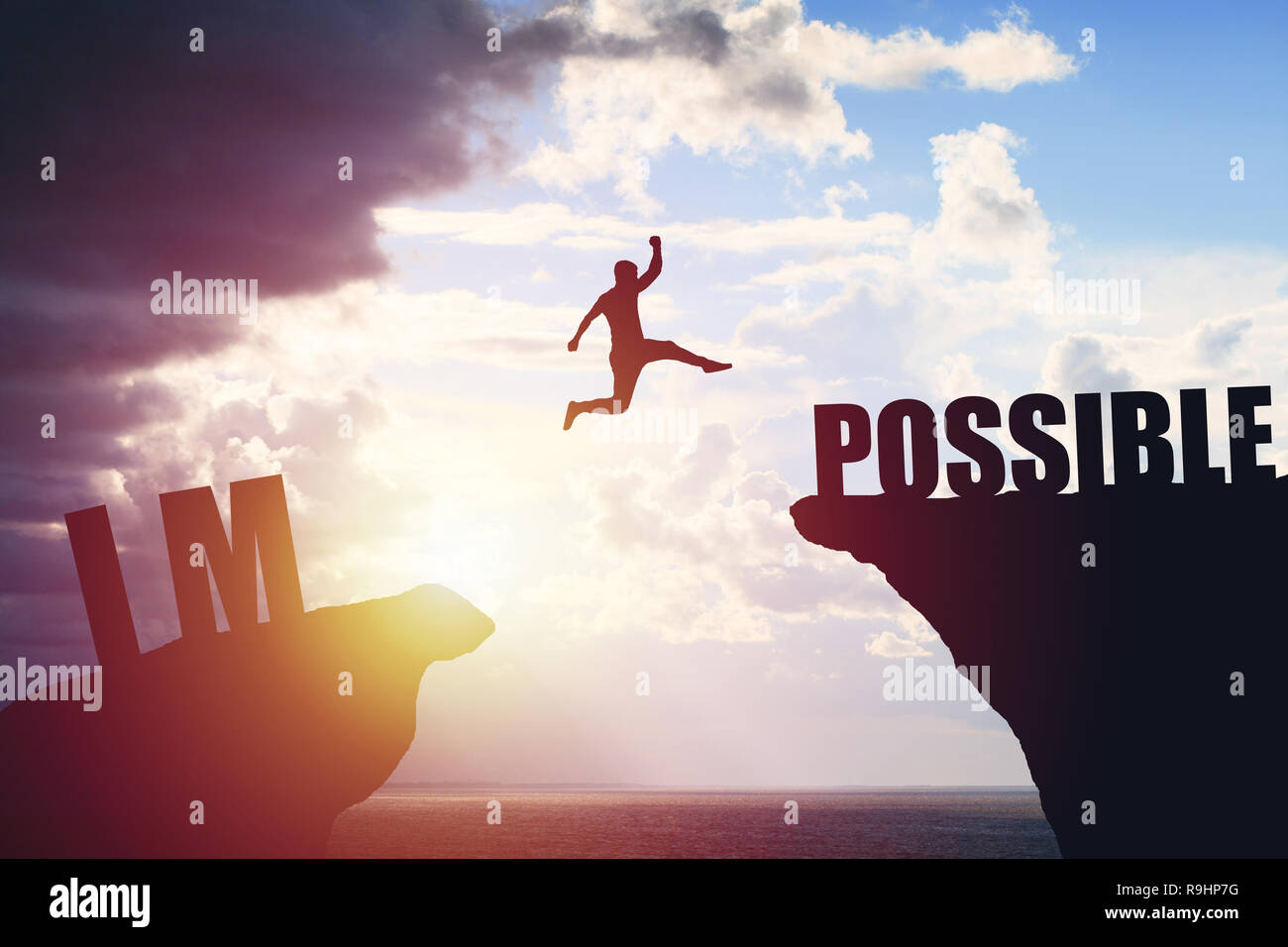 Silhouette of business man jump to success text over a beautiful high ...