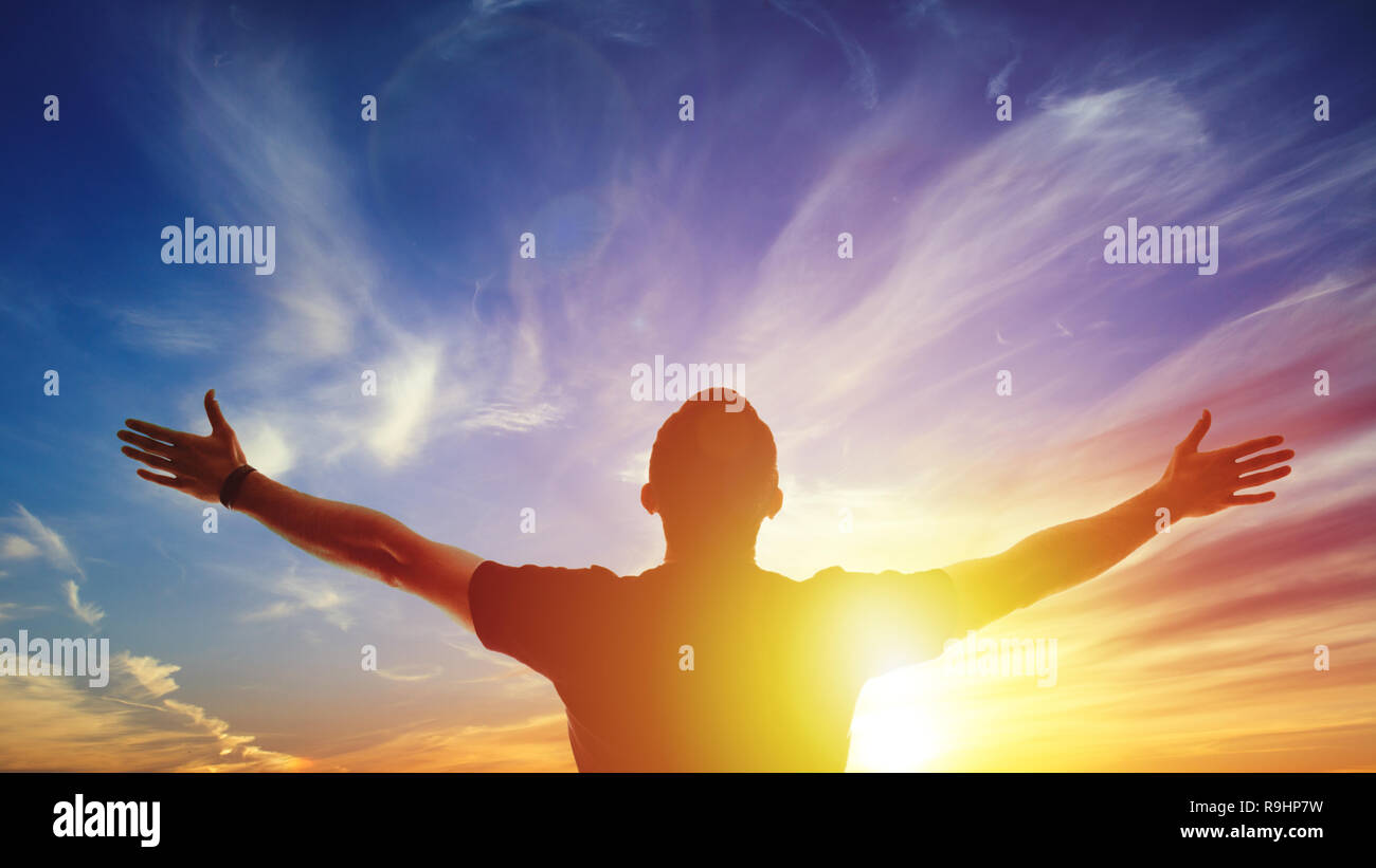 Person on background sunrise. Bright solar glow and sky Stock Photo - Alamy