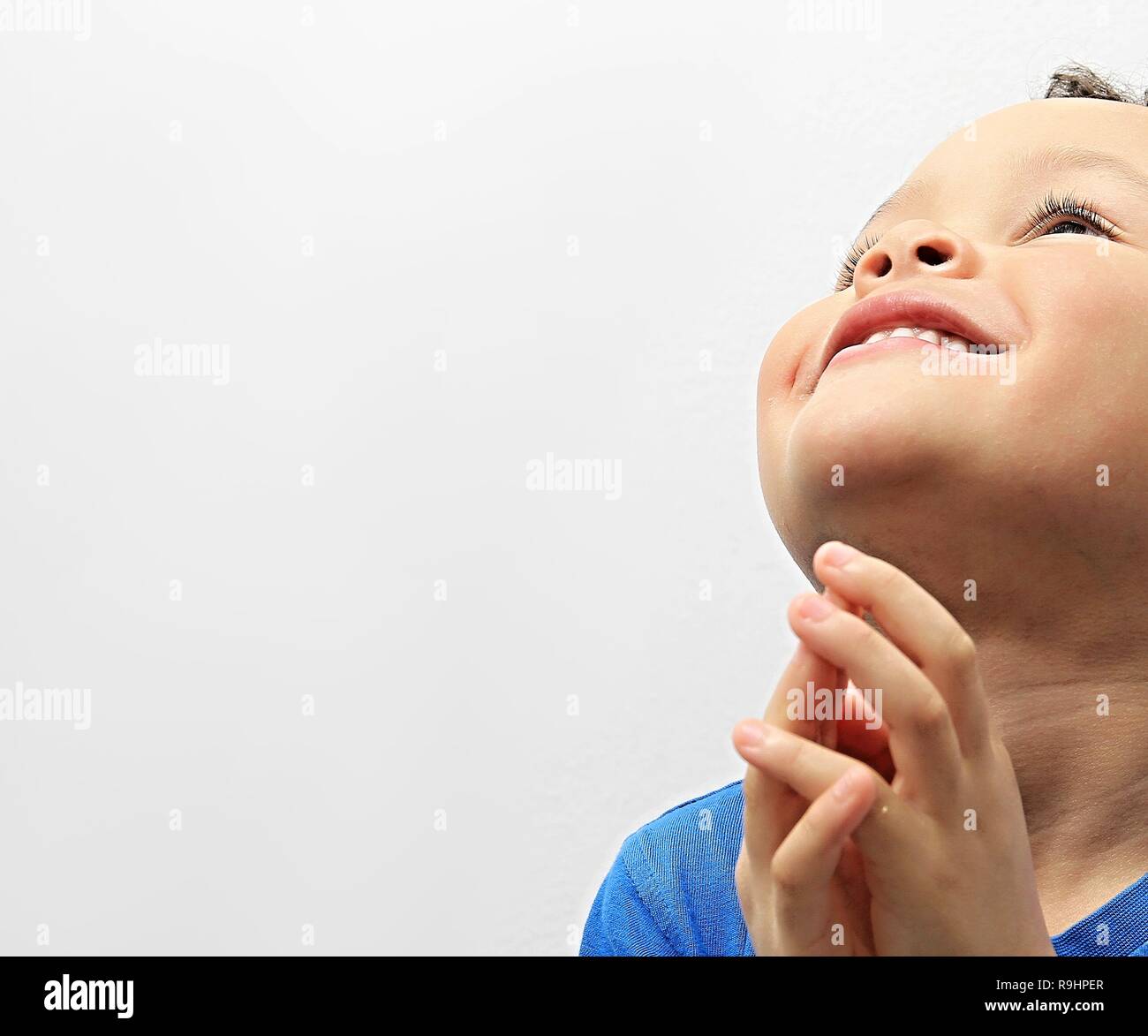 little boy praying to God with hands together stock photo Stock Photo ...