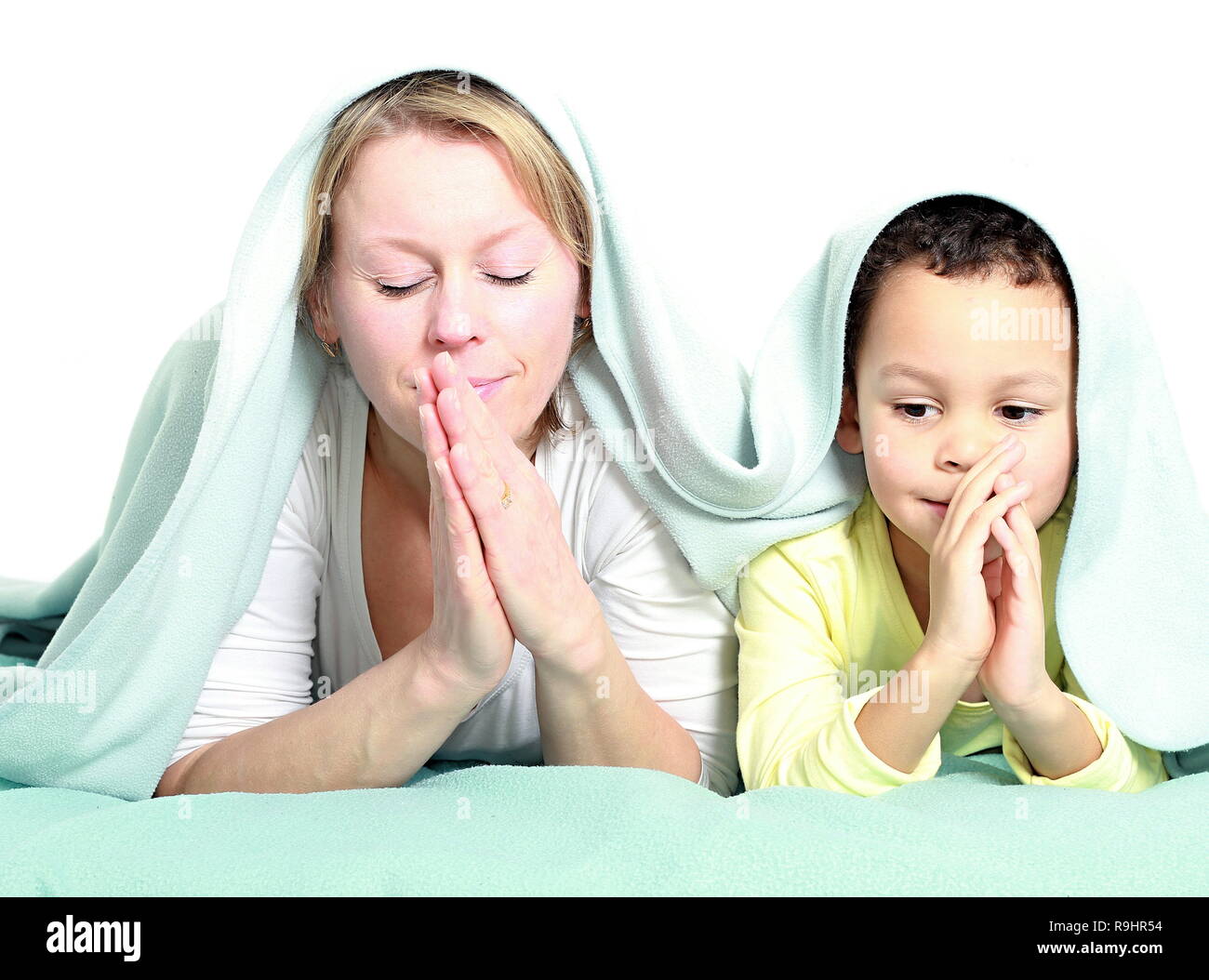Mother and child praying together stock image and stock photo Stock ...