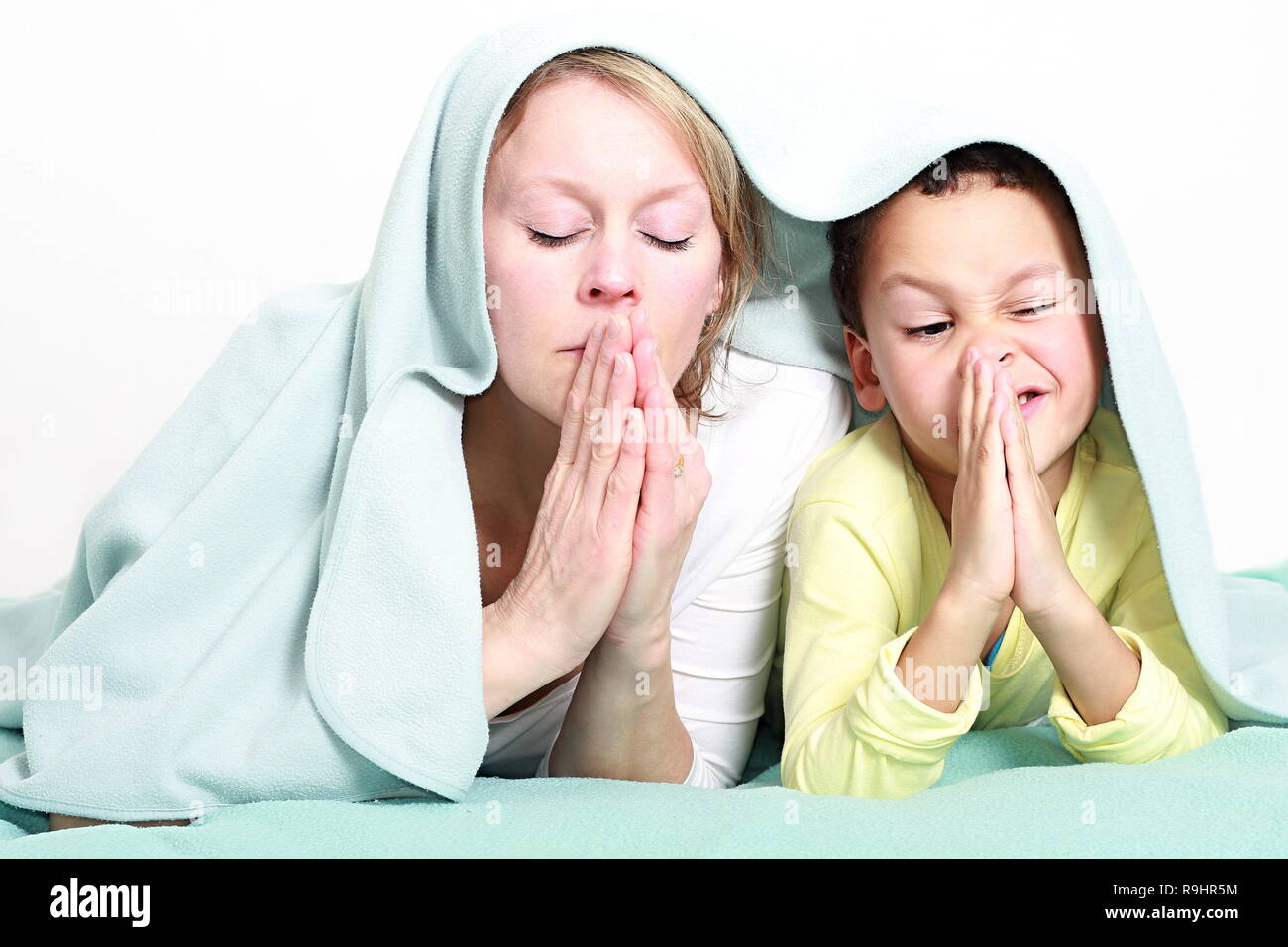 Child mother praying hi-res stock photography and images - Alamy