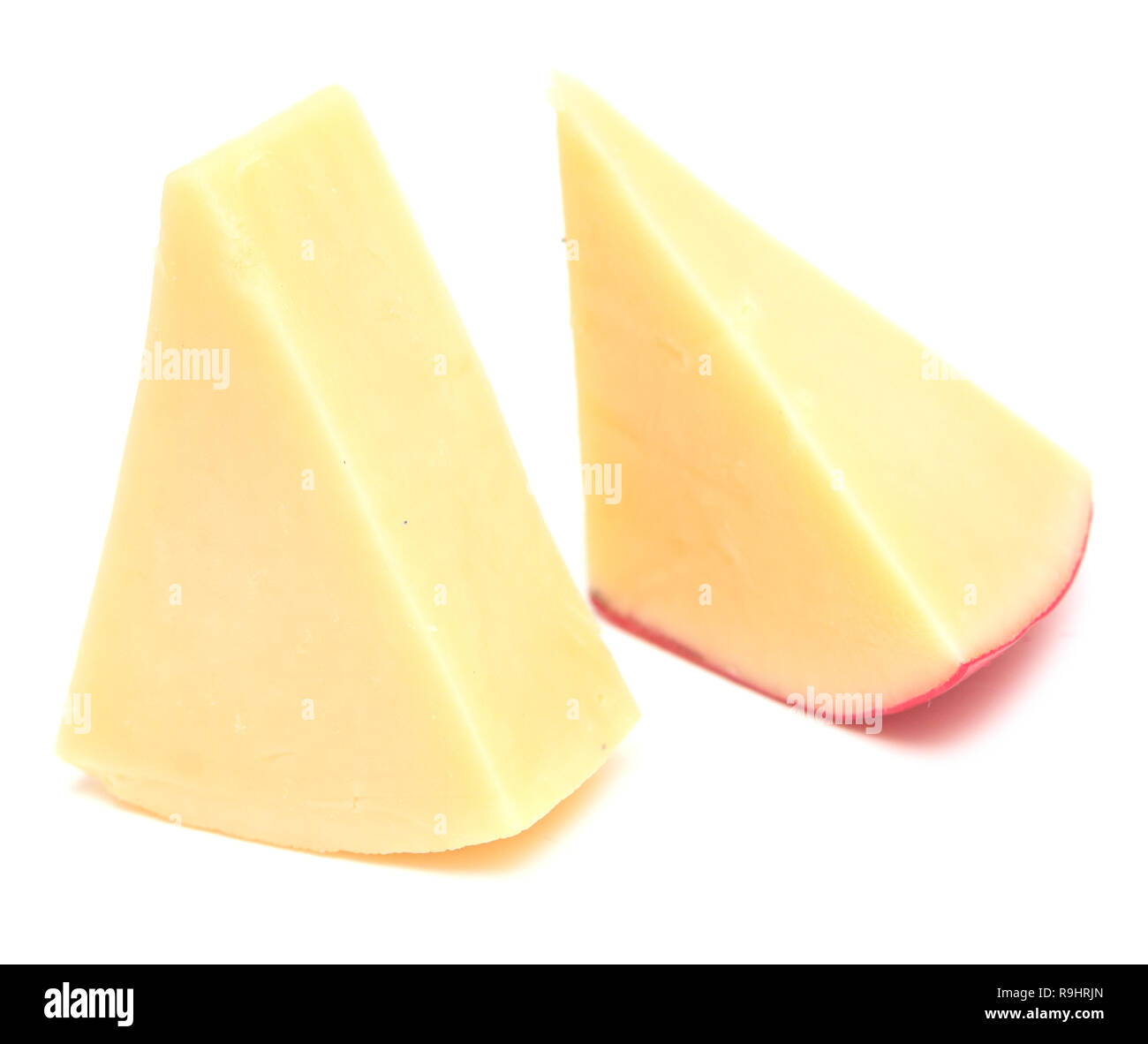 Two pieces of cheese isolated on white background Stock Photo - Alamy