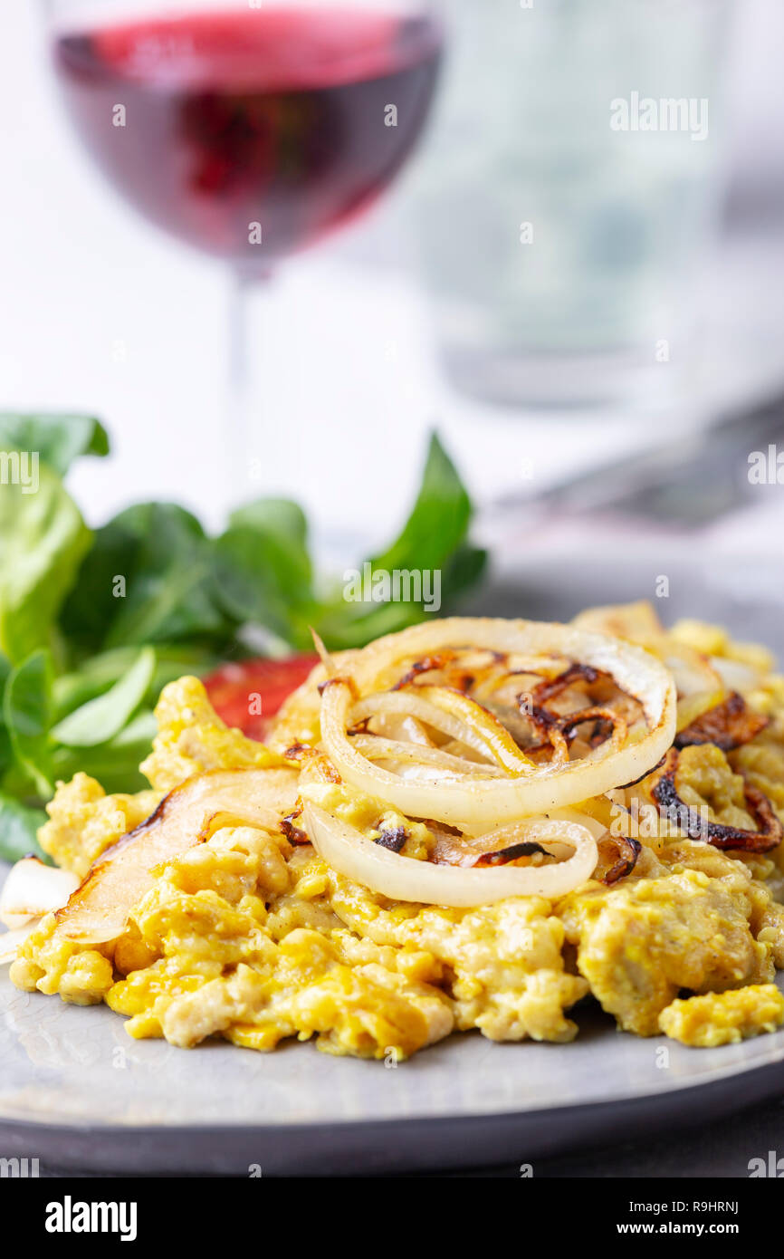 austrian spaetzle with salad and wine Stock Photo - Alamy