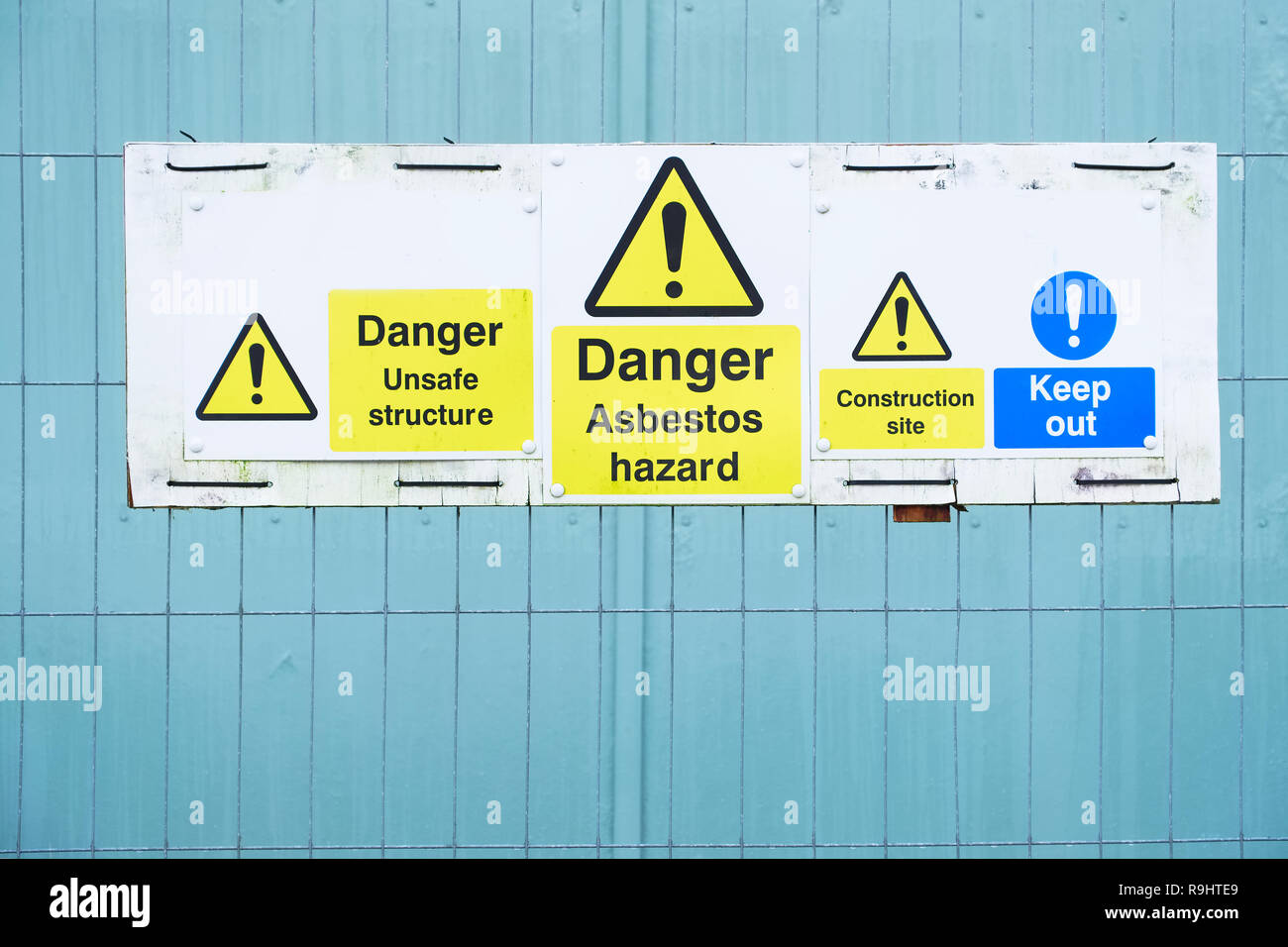 Asbestos hazard danger sign at construction site keep out Stock Photo ...