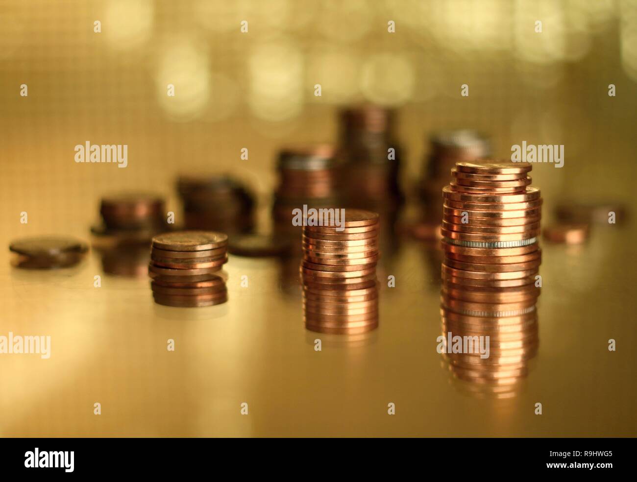 money coins piled up on a shiny surface no people stock photo Stock ...