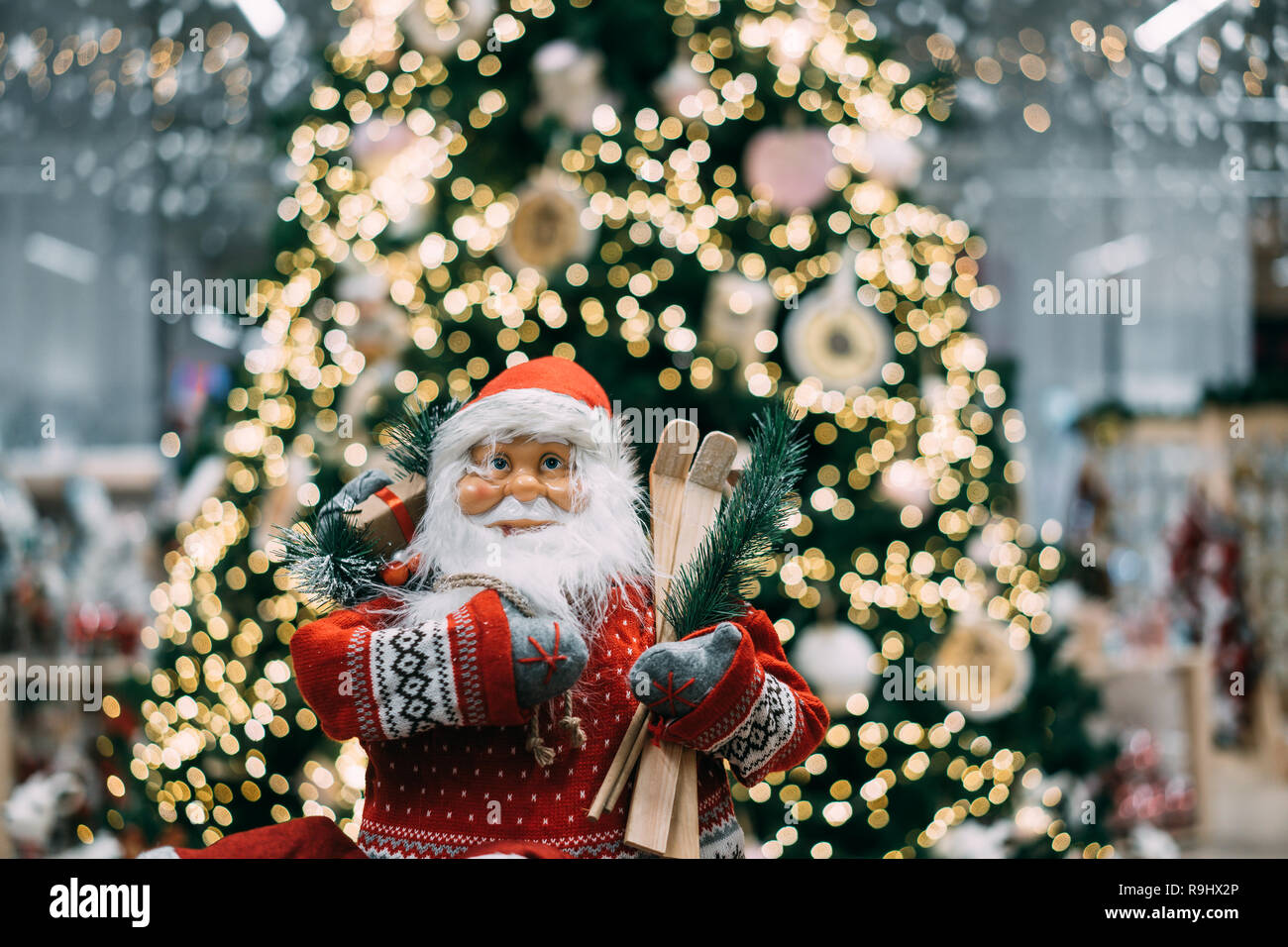 Happy Santa on background of bokeh christmas tree Stock Photo - Alamy