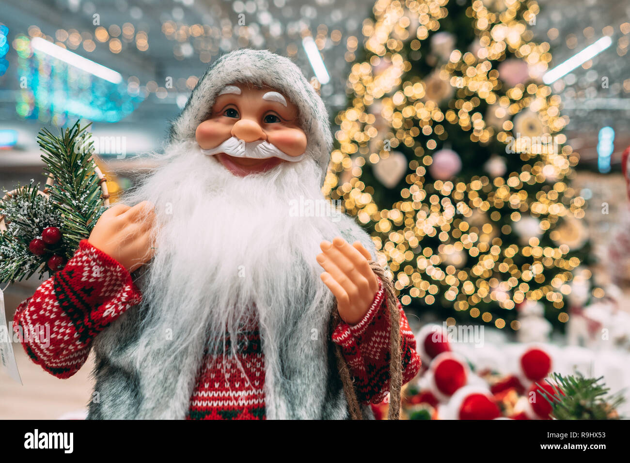Happy Santa on background of bokeh christmas tree Stock Photo - Alamy