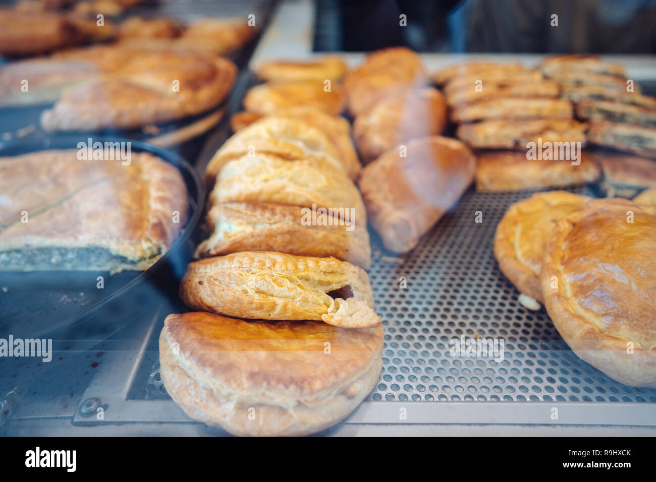 Fresh bakery in showcase of a street shop bakery food Stock Photo - Alamy