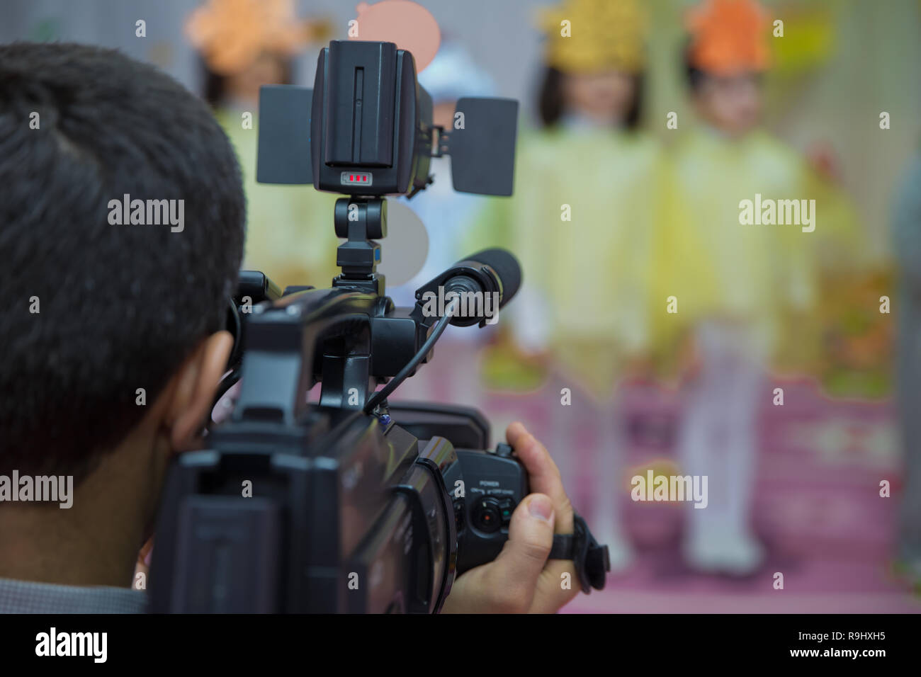 Video camera operator working with his equipment - Image . Video Camera ...