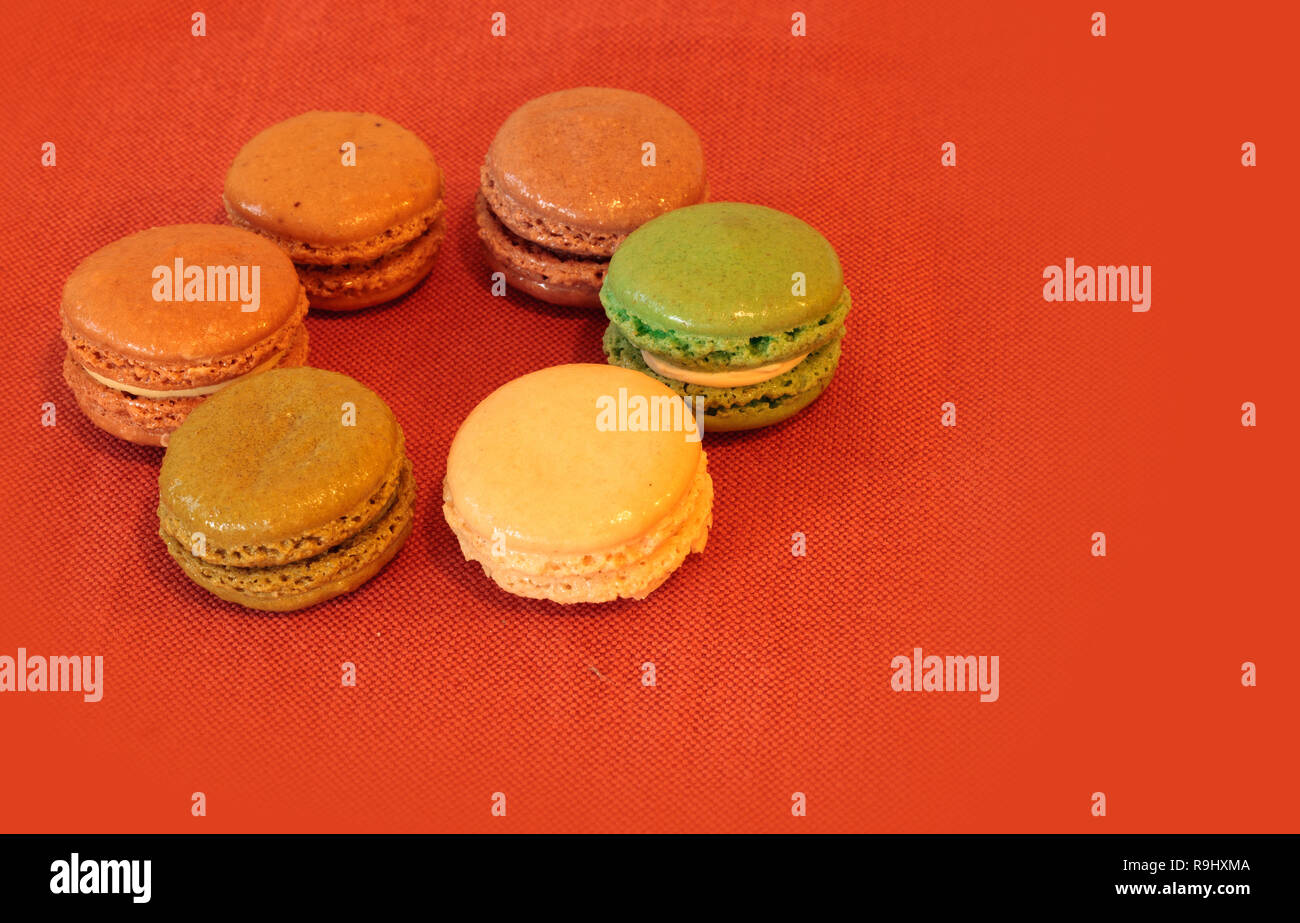 French Macaroon cookies in fall colors in green, yellow and orange laid ...