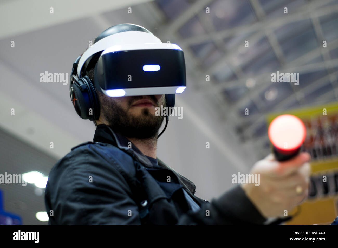 man in VR headset who enjoying game. Virtual reality. man in VR headset ...
