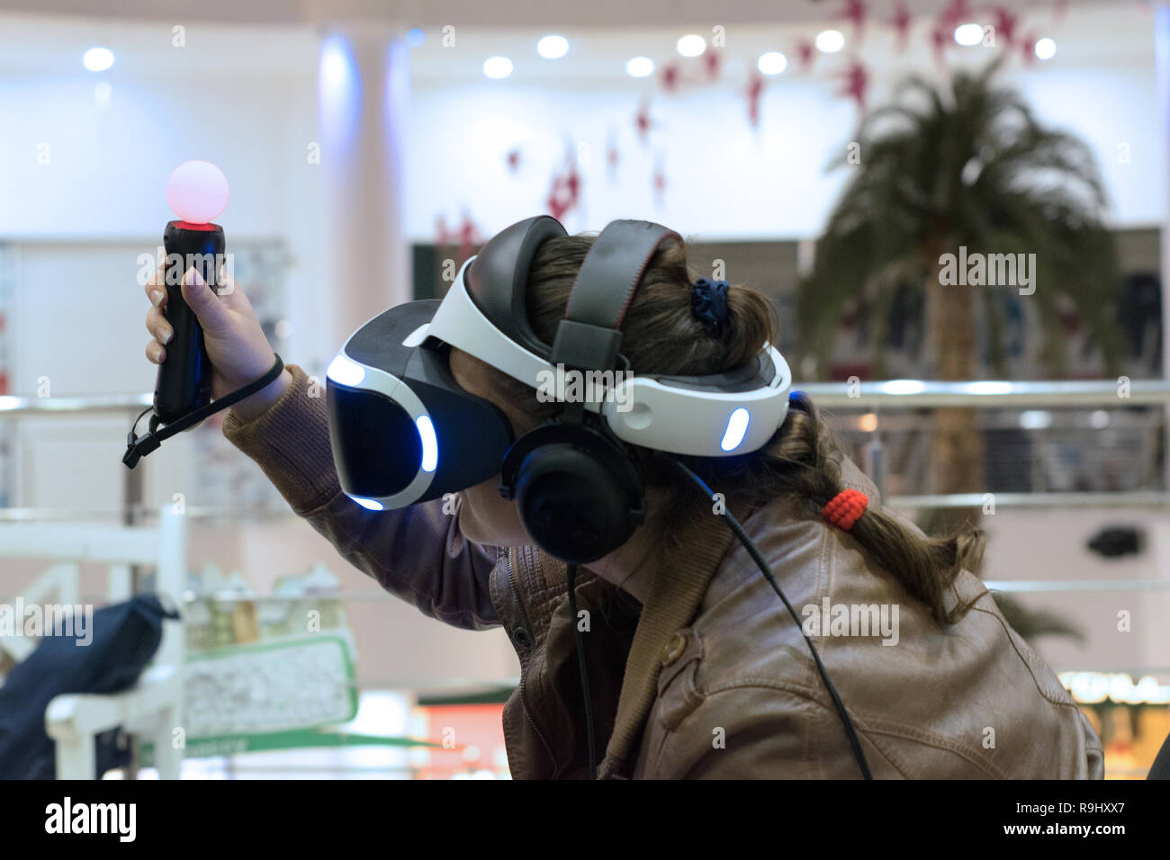 girl in VR headset who enjoying game. Virtual reality. teen in VR ...