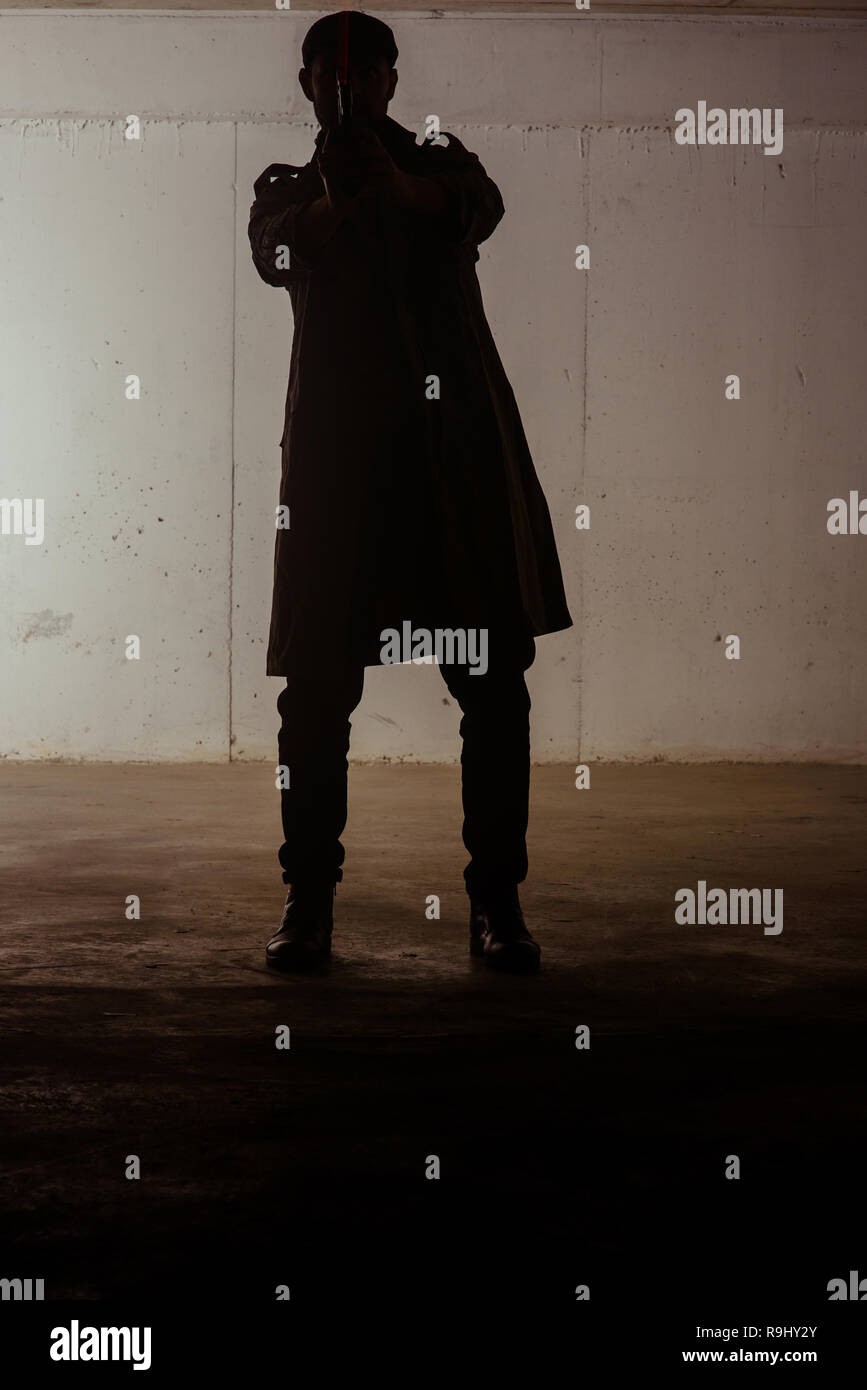 Male Gangster Holding Gun Isolated Stock Photos & Male Gangster Holding ...