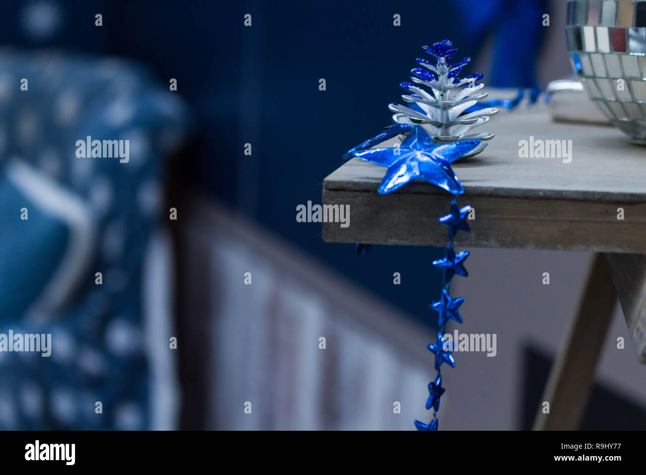 New Year Decorations of blue color lie on the shelf. NY Stock Photo - Alamy
