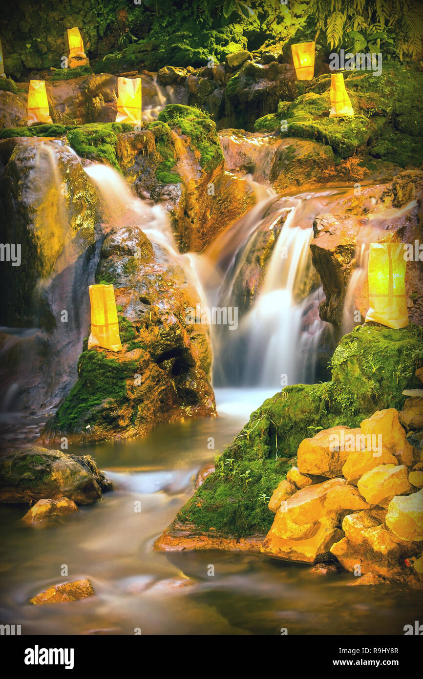 refreshing natural landscape with a waterfall that looks beautiful in a ...