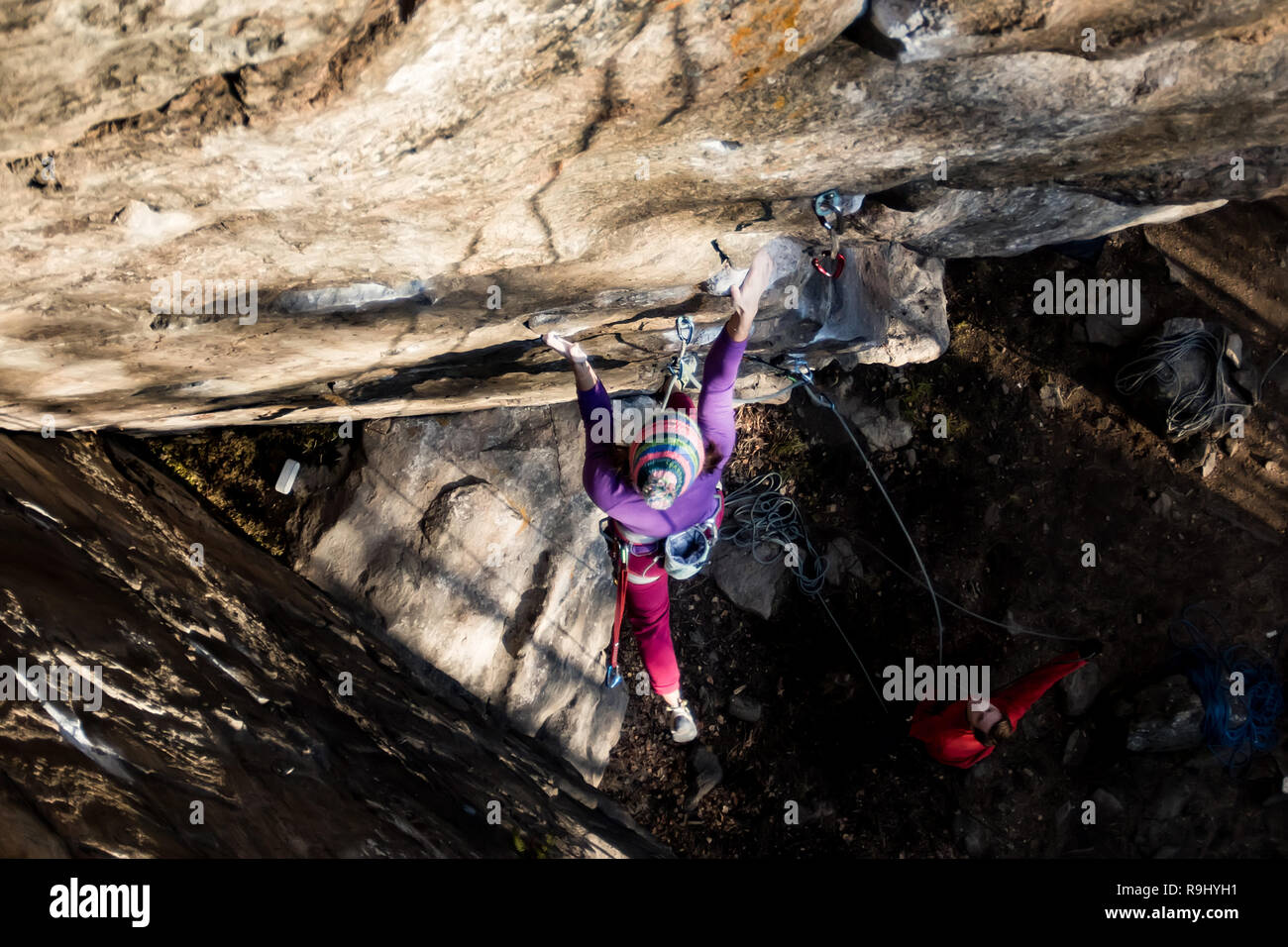 Young female climber in the lead on the climbing wall hi-res stock ...