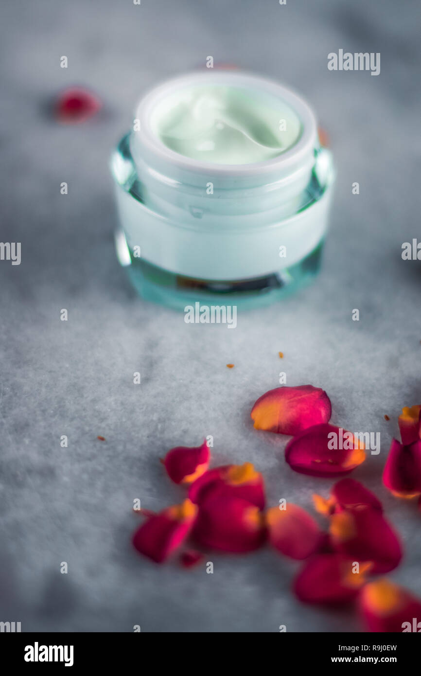 luxe face cream and rose petals - cosmetics with flowers styled beauty ...
