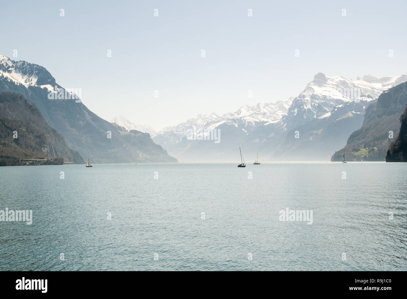 BRUNNEN, SWITZERLAND - APRIL 7, 2018: Small boat sailing on Lake ...