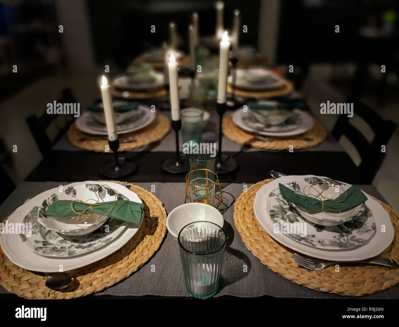 Dinner table setting by candlelight, Christmas Family Dinner Concept ...