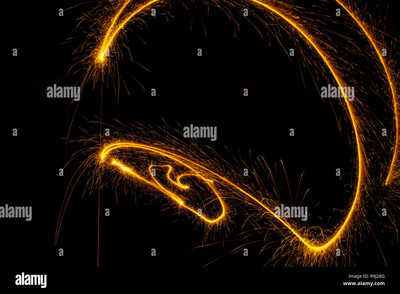 Abstract sparkler firework light on black background. Long exposure ...