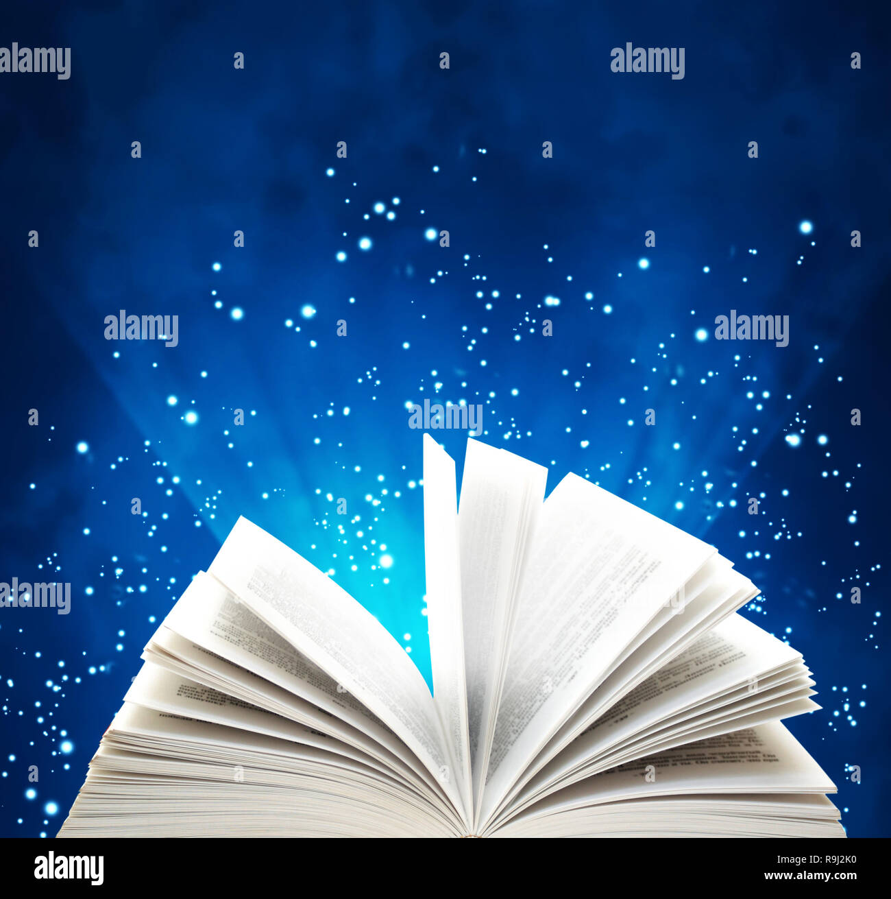 Border with magic book. On blue background Stock Photo - Alamy