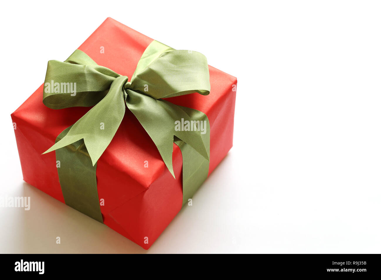 Red gift box isolated on white with close-up for design in Christmas ...