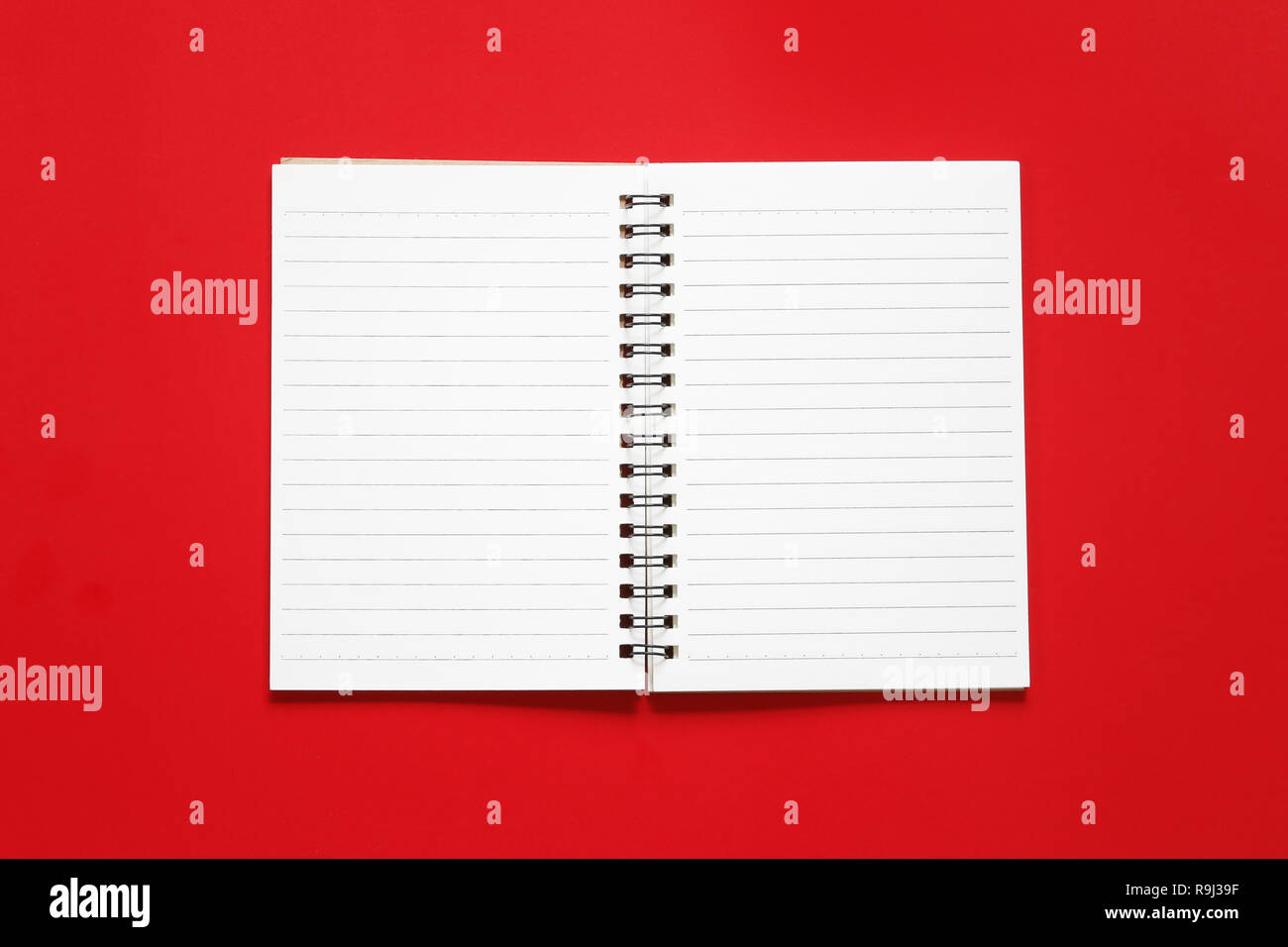 Blank notebook paper on a red art paper background for design in ...