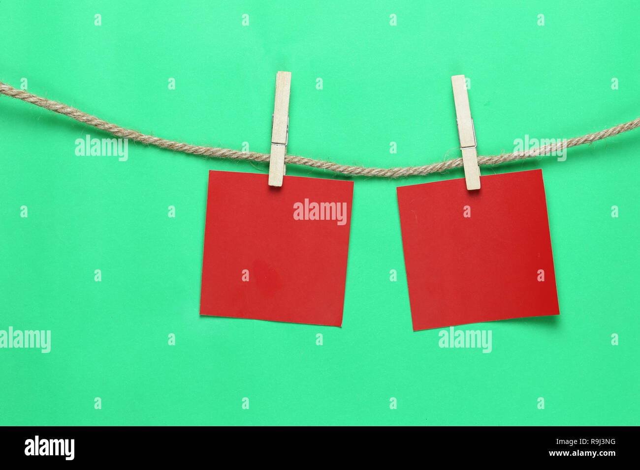 Red paper note hang on hemp rope and have copy space for design in your ...