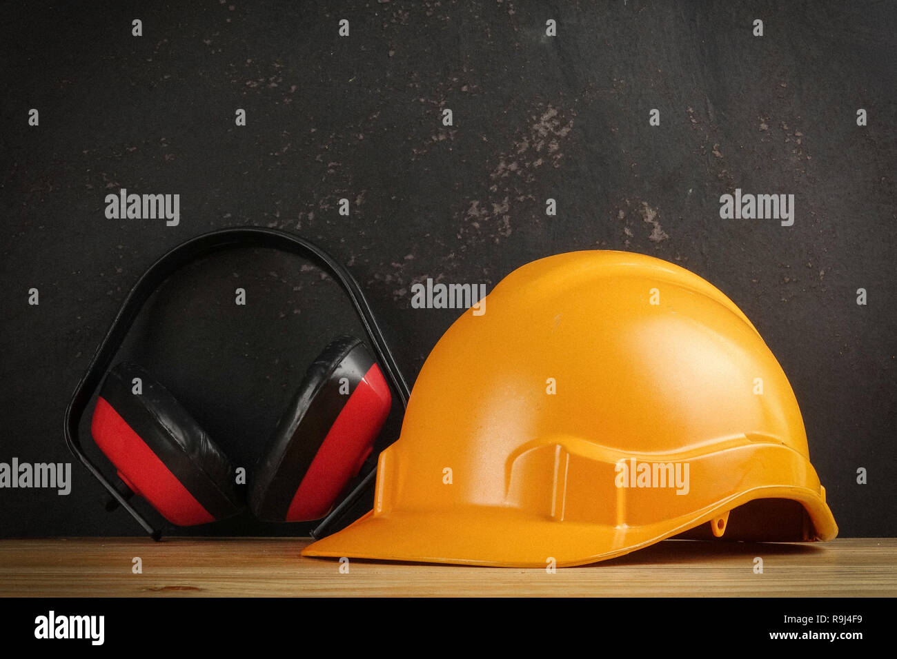 Safety Personal Protective Equipment(PPE) on a rustic black background ...