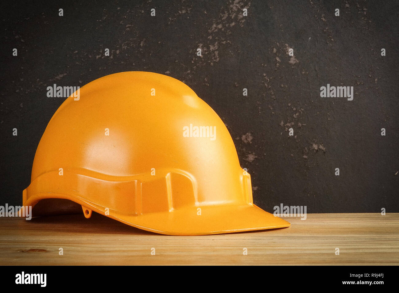 Safety Personal Protective Equipment(PPE) on a rustic black background ...