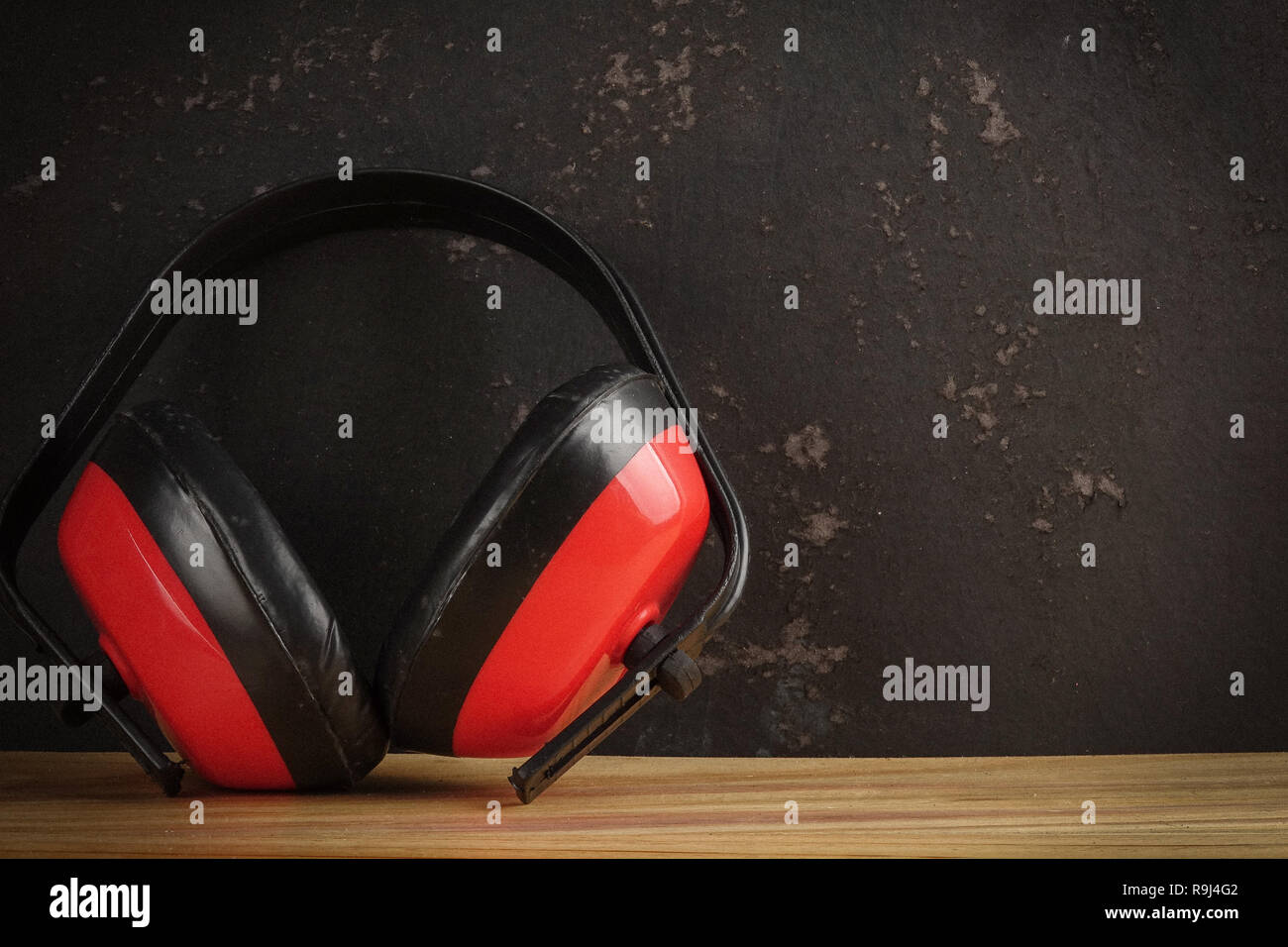 Safety Personal Protective Equipment(PPE) on a rustic black background ...