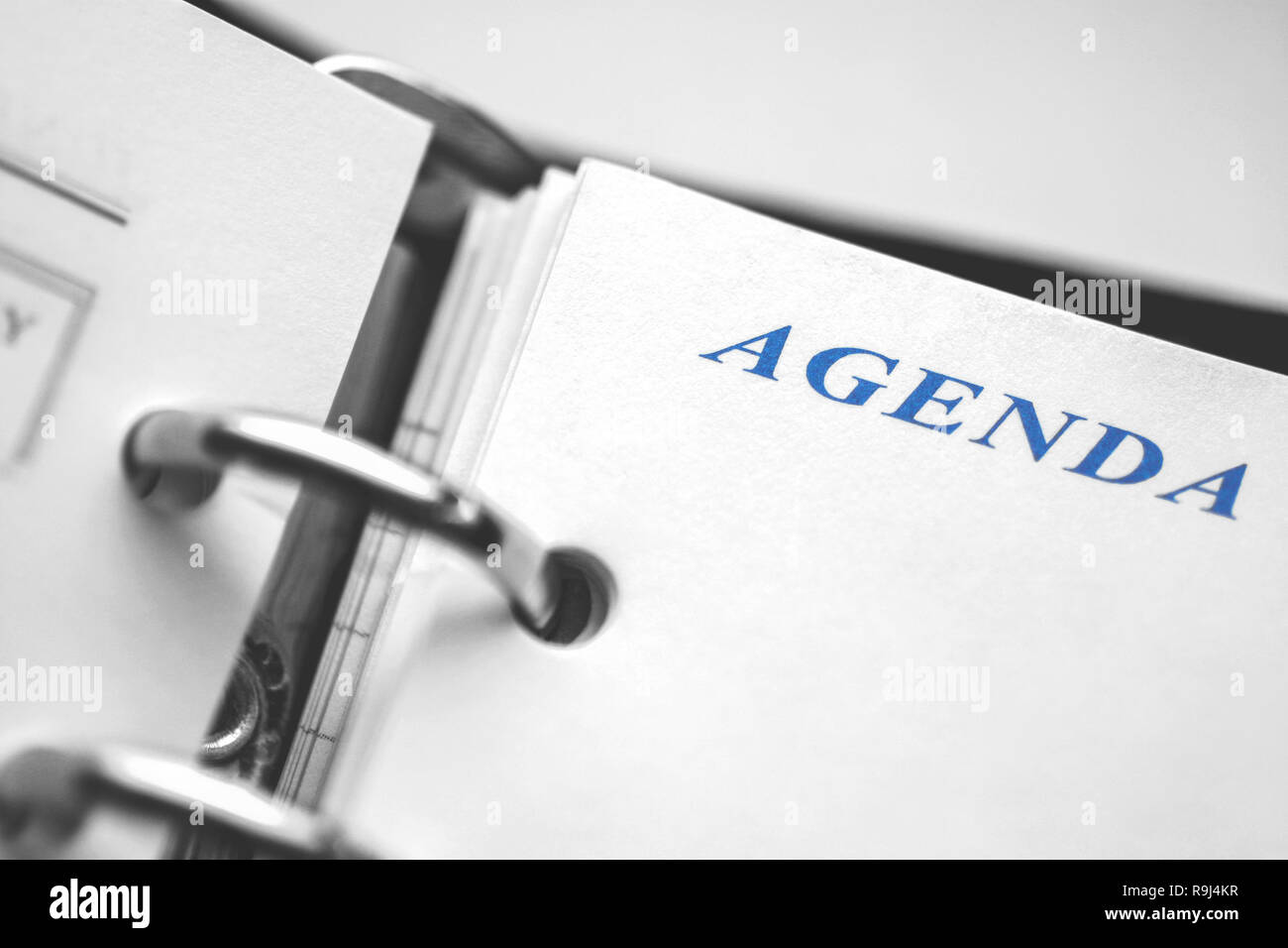 Daily agenda paper planner closeup. Black and white picture with blue ...