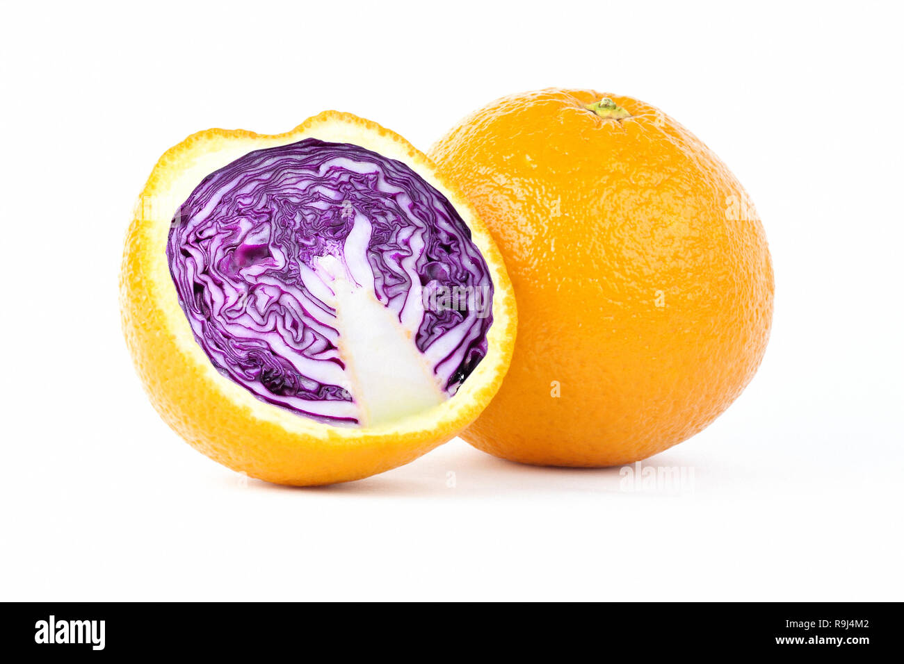 Creative photo manipulation of sliced orange with red cabbage inside ...