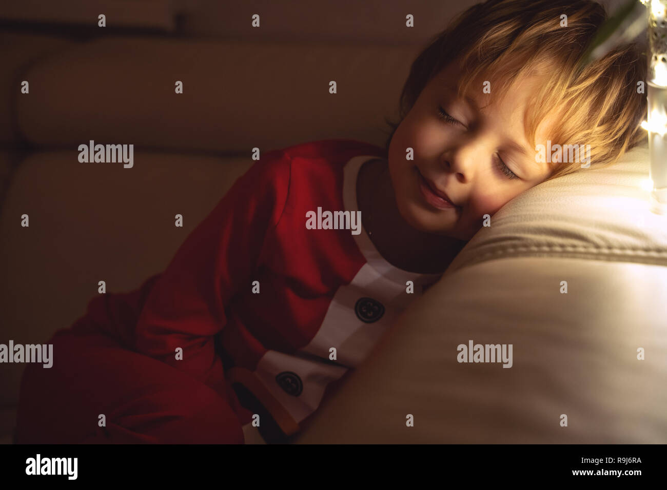 Boy sleeping under tree hi-res stock photography and images - Alamy